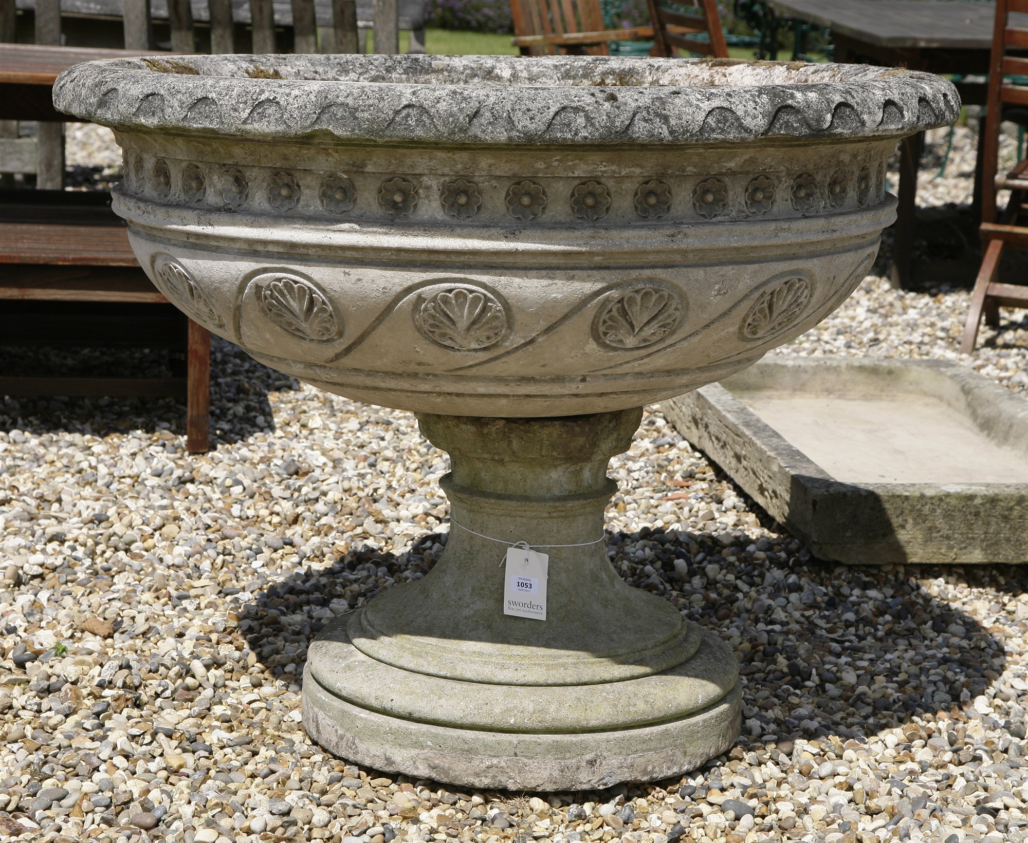 Lot 1053 - A Large reconstituted stone garden urn with