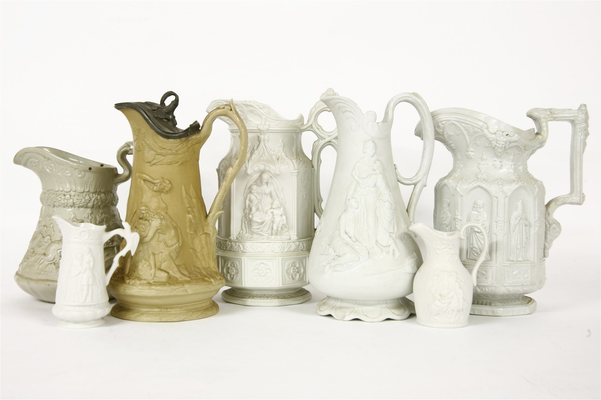 Lot 493 - A collection of stoneware relief moulded