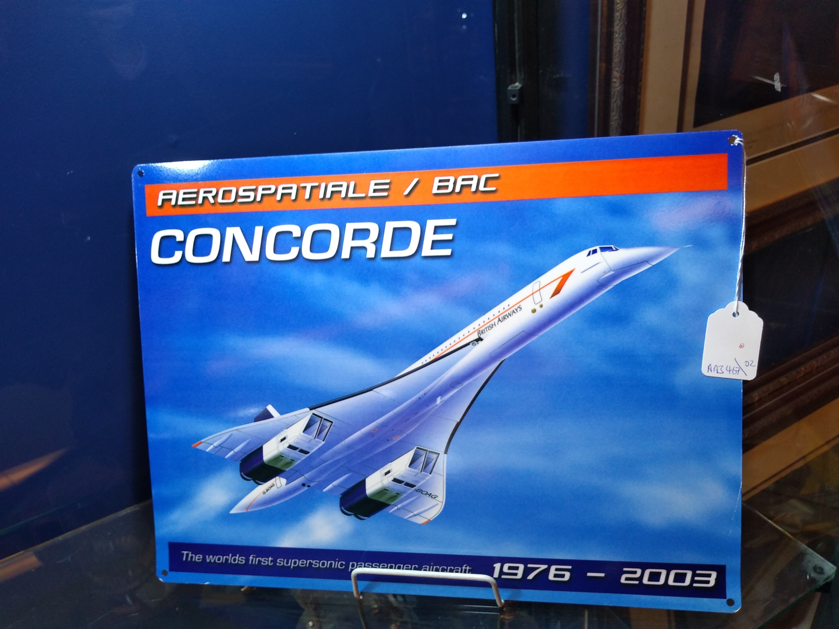 Lot 128 - An aluminium model of Concorde on stand,