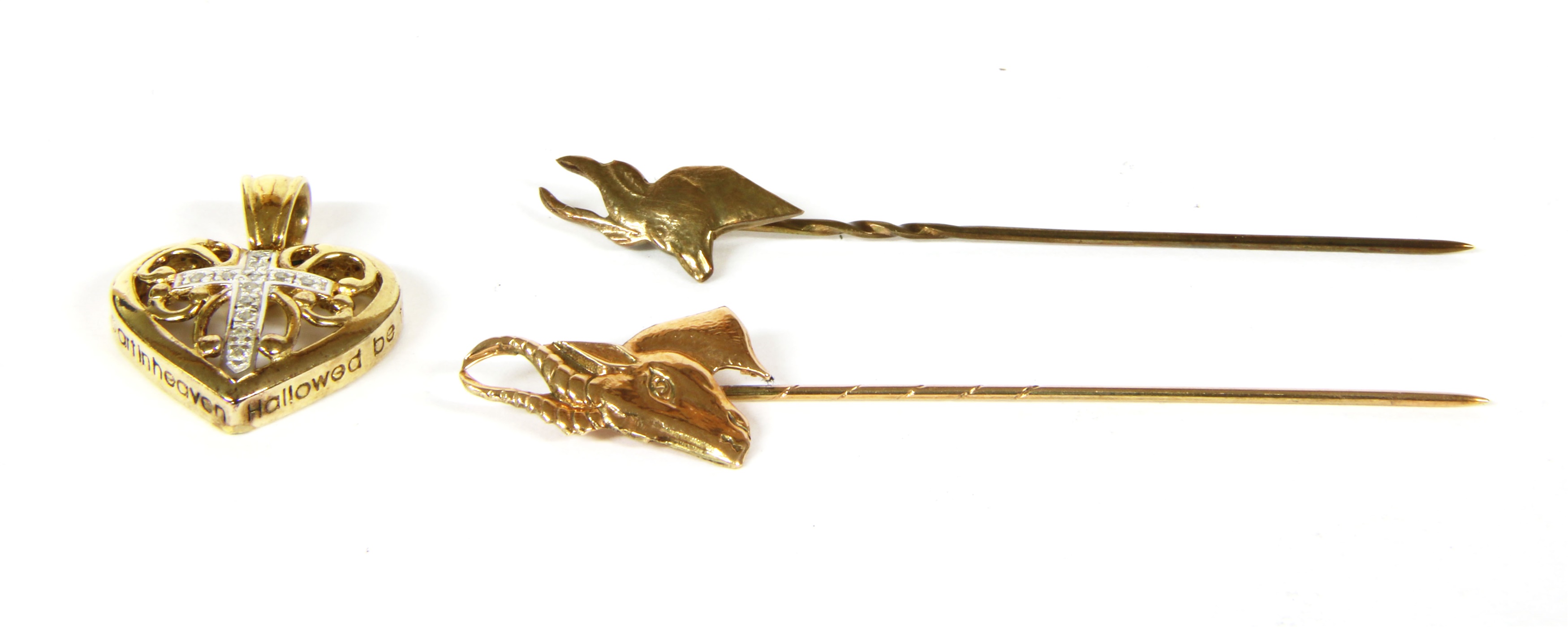 Lot 9 - Two gold Springbok stick pins,
