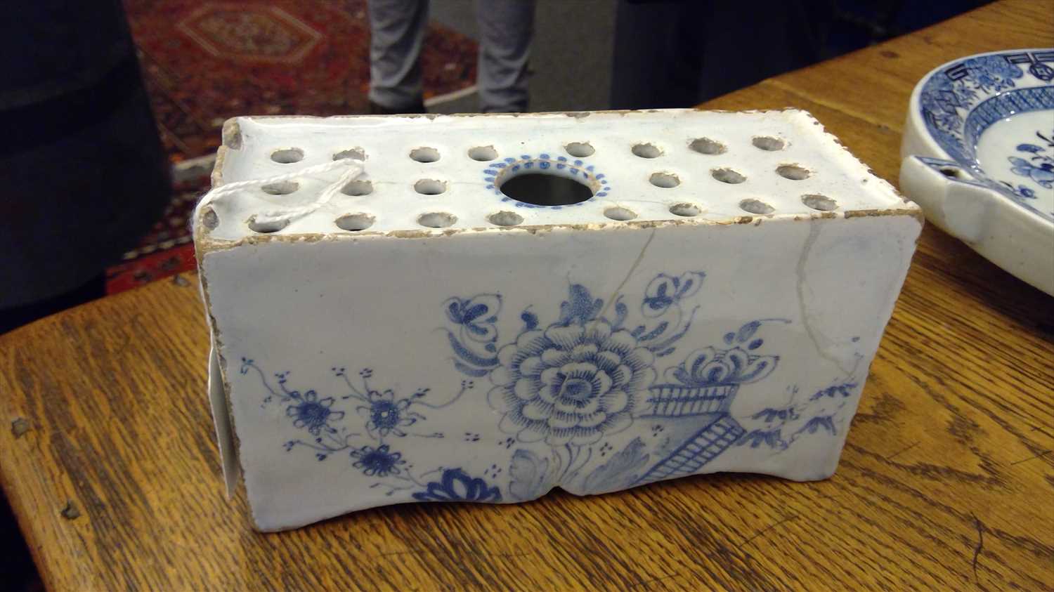 Lot 121 - An 18th century Delft flower brick,