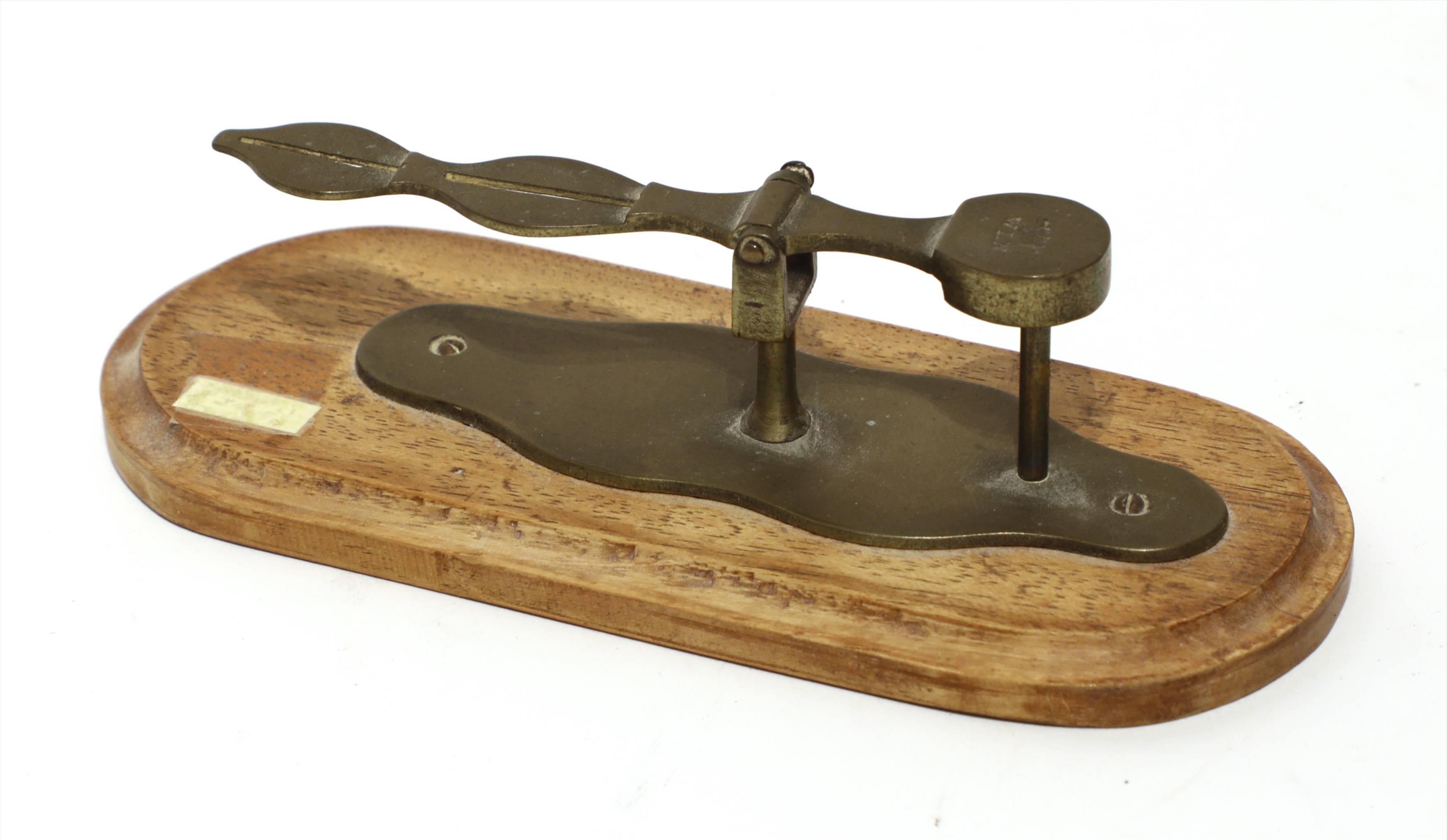 Lot 1030 - A brass sovereign rocker,