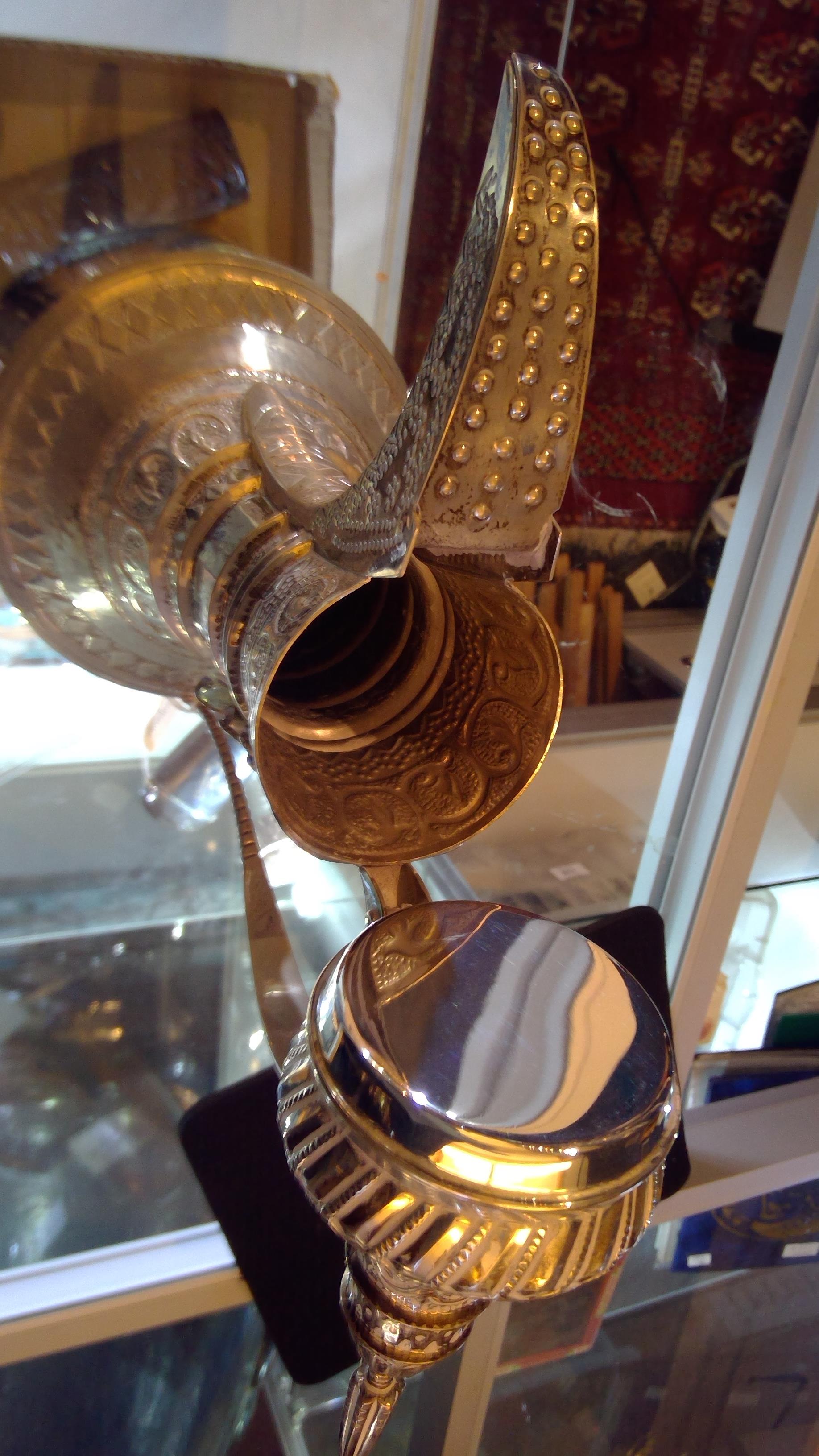 Lot 129 - A modern silver Dallah coffee pot,