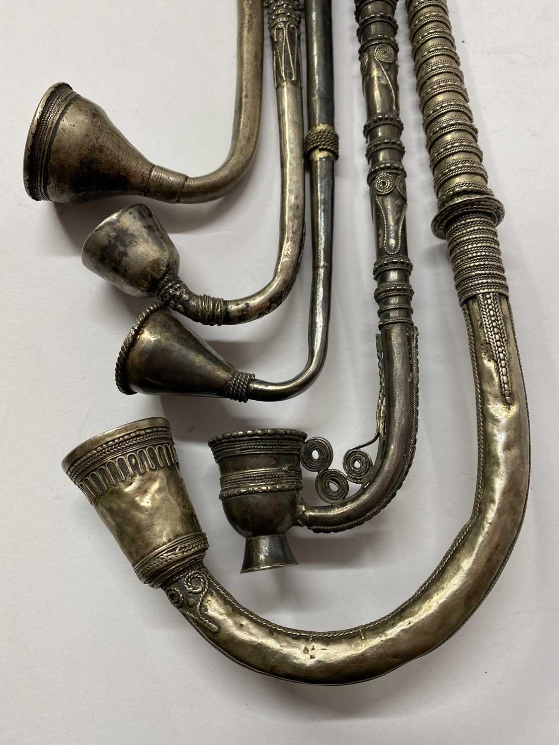 Lot 7 - Five Thai silver pipes,