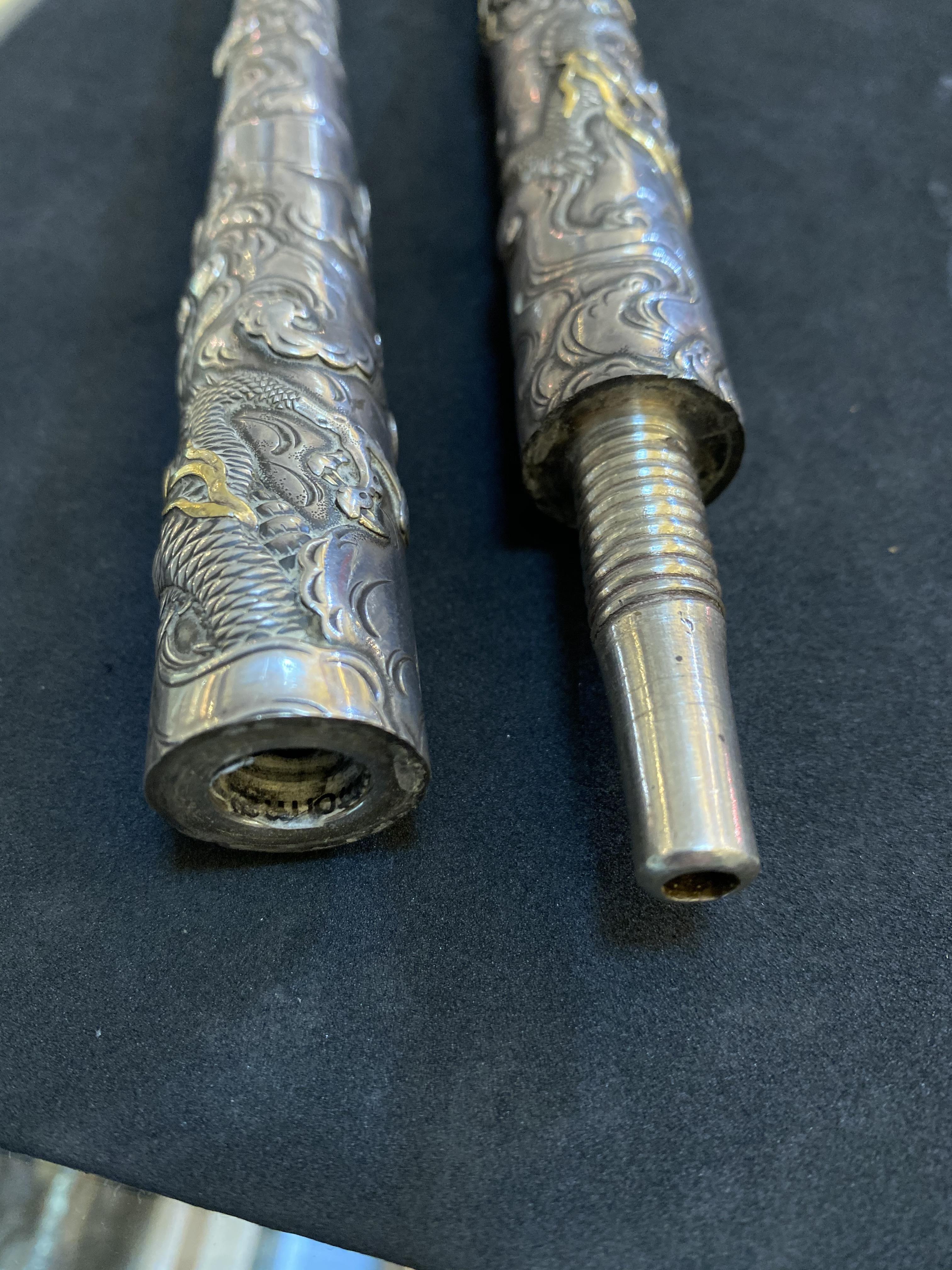 Lot 19 - A Japanese silver two-part kiseru pipe,