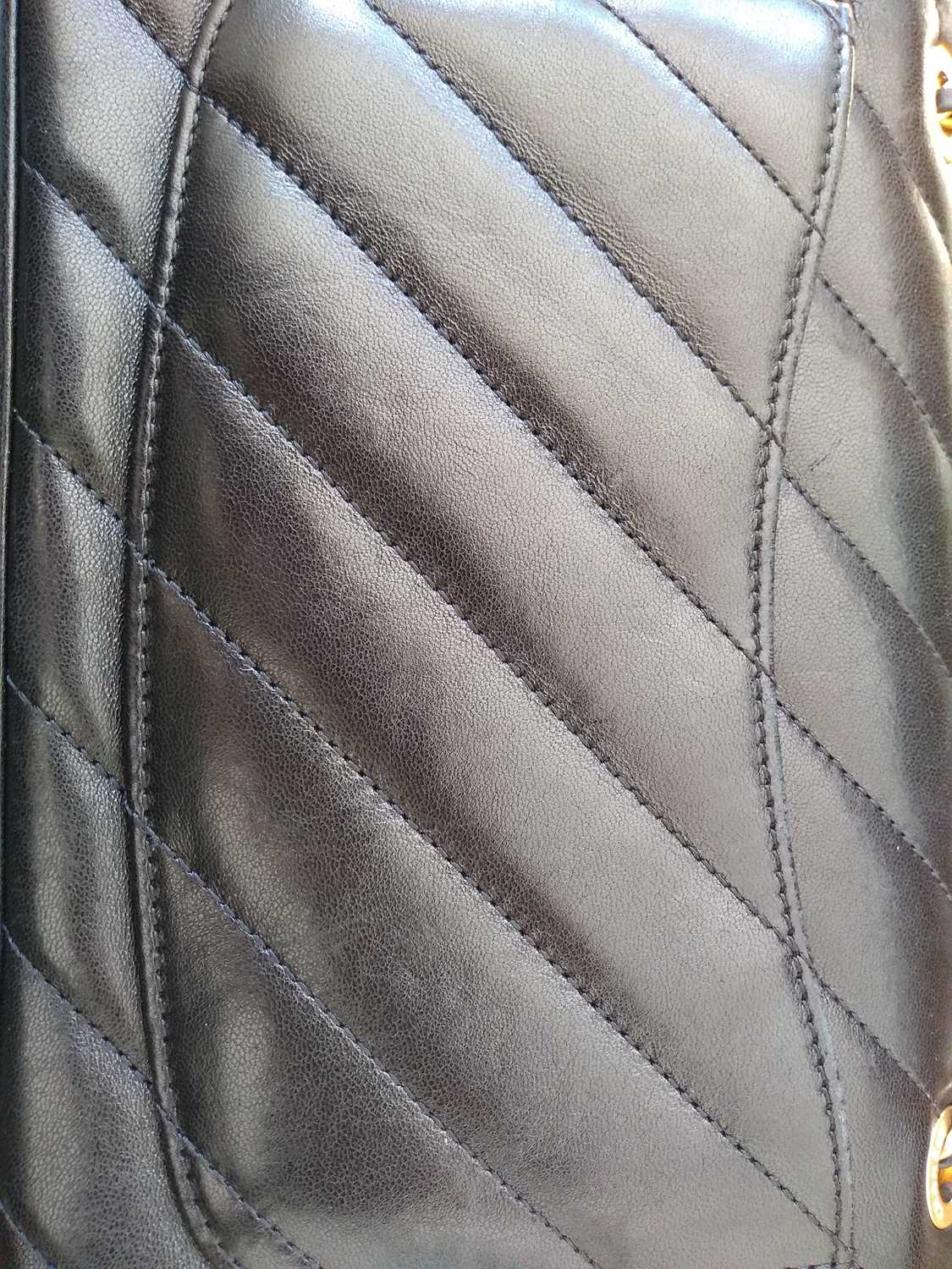 Lot 410 - A Chanel black chevron flap bag,