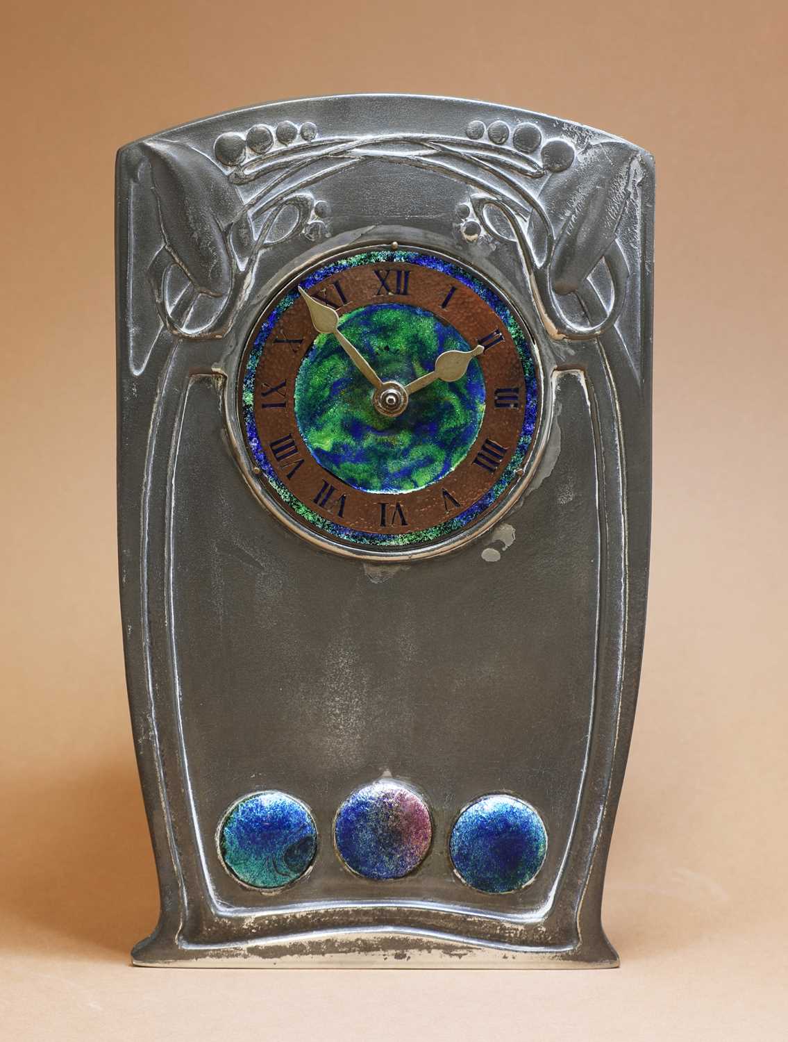 Lot 197 - A Tudric pewter and enamel clock, designed