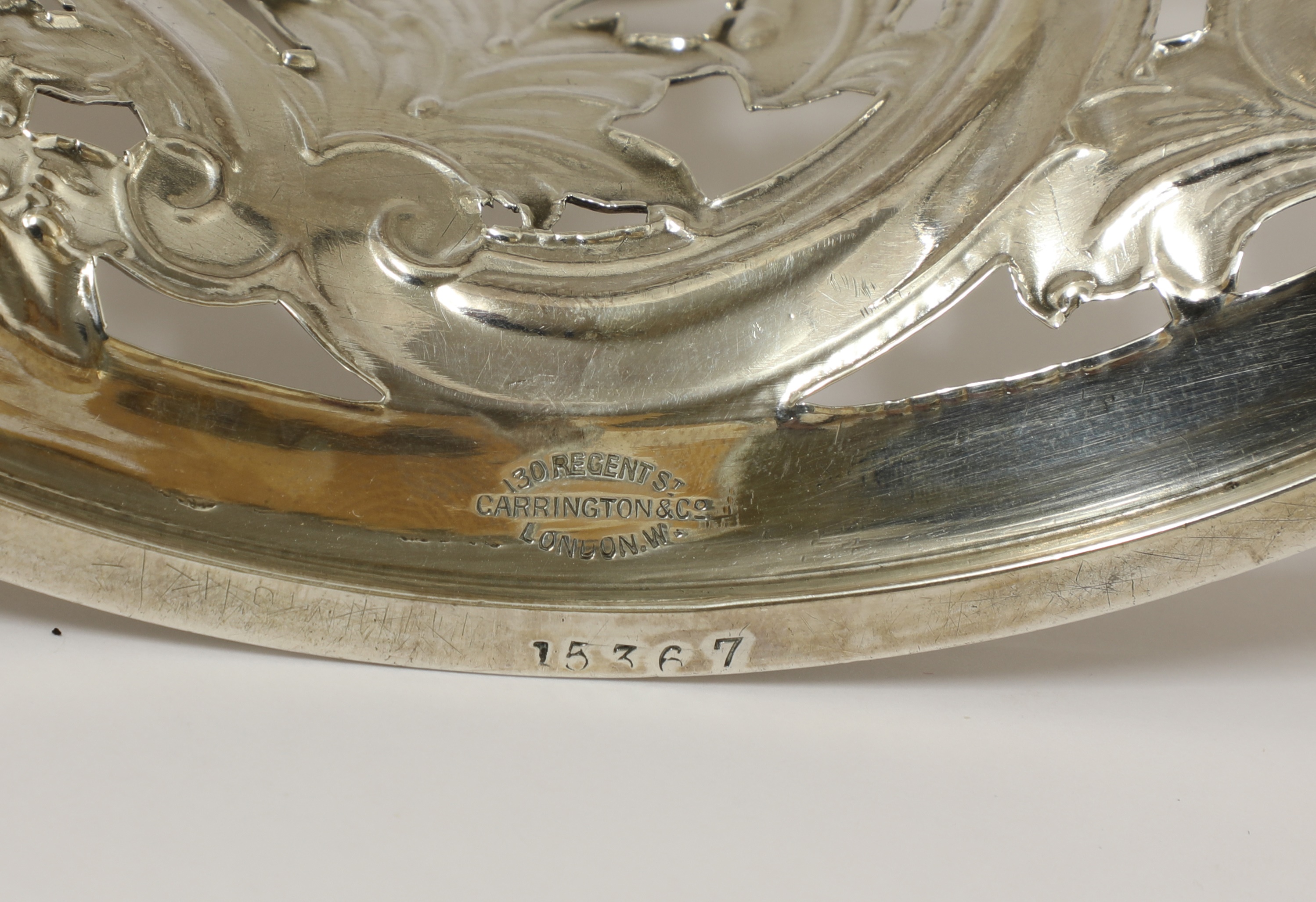 Lot 34 - A silver potato ring,