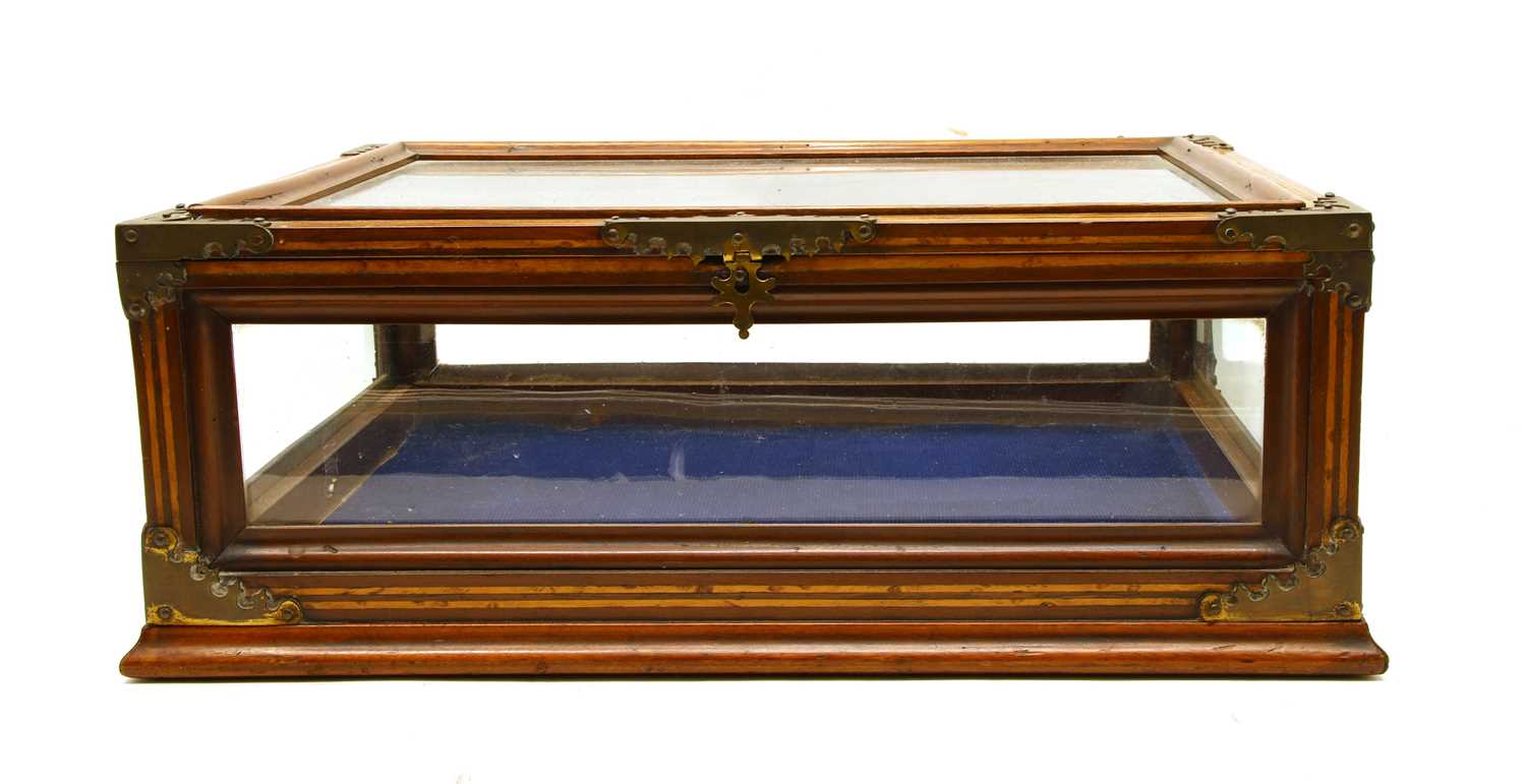 Lot 228 - A brass mounted mahogany table top vitrine,