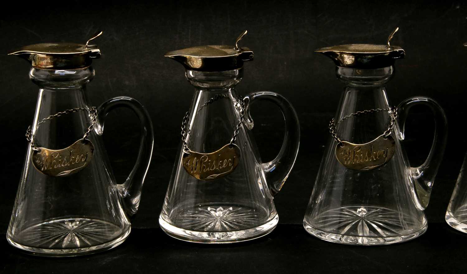 Lot 18 - Five silver topped glass whisky tots