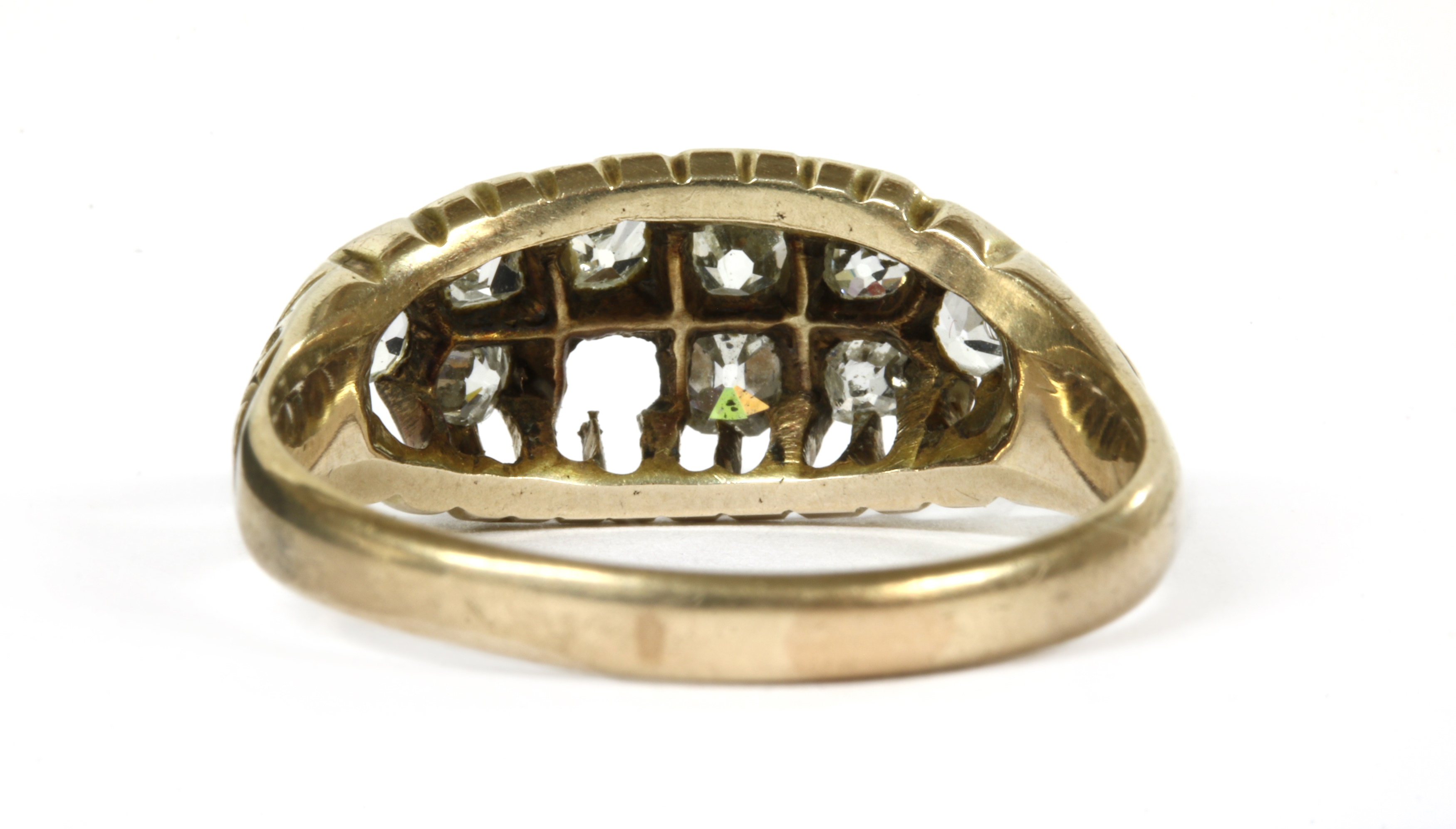 Lot 11 - A gold boat shaped diamond ring,