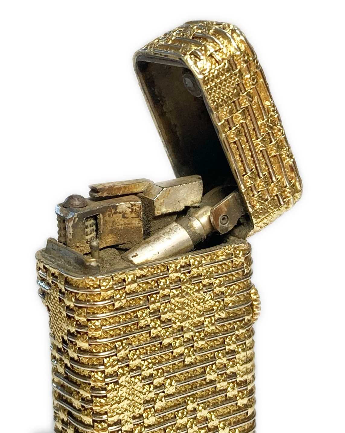 Lot 333 - A gold Dunhill lighter,
