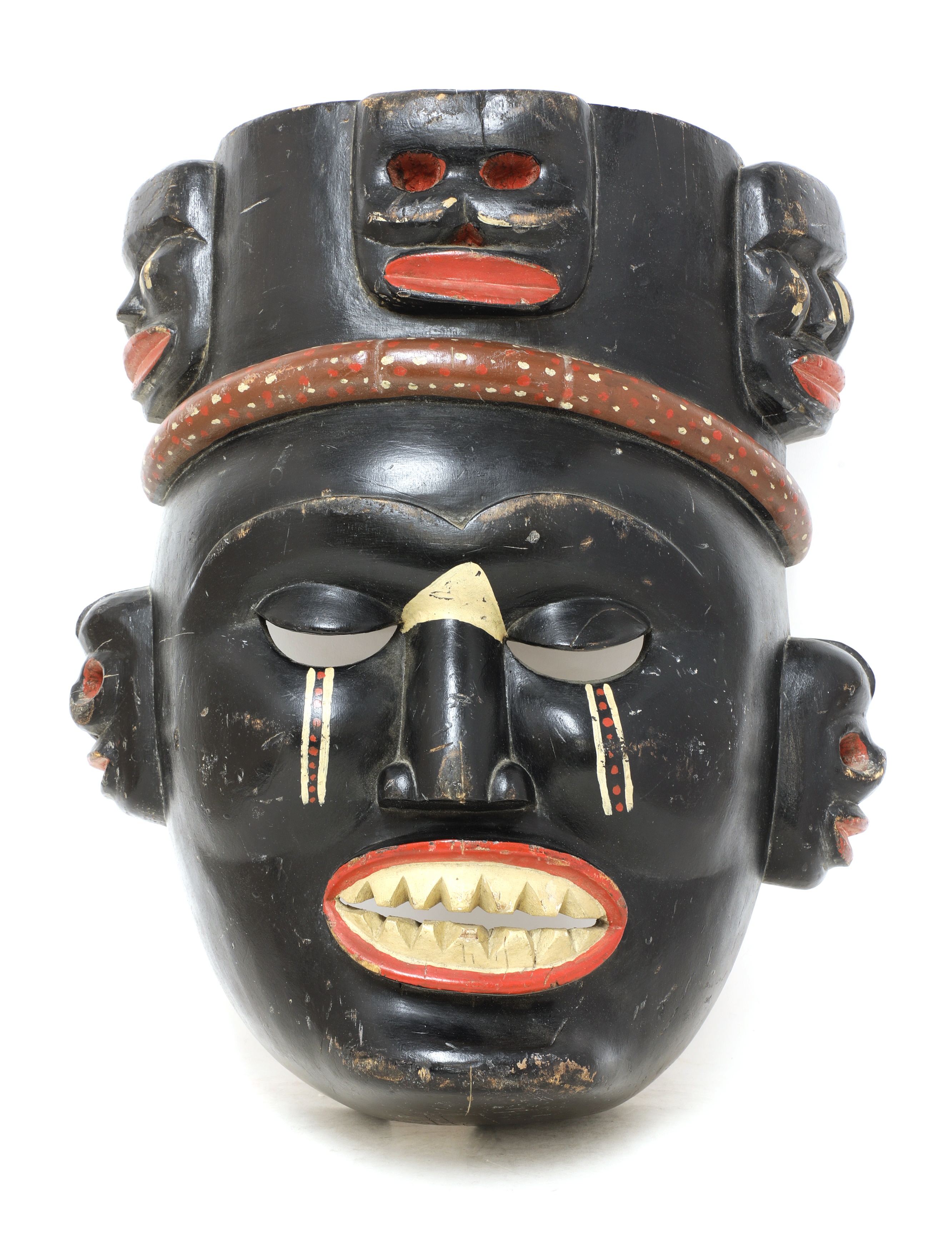Lot 384 - A large carved wood tribal mask,