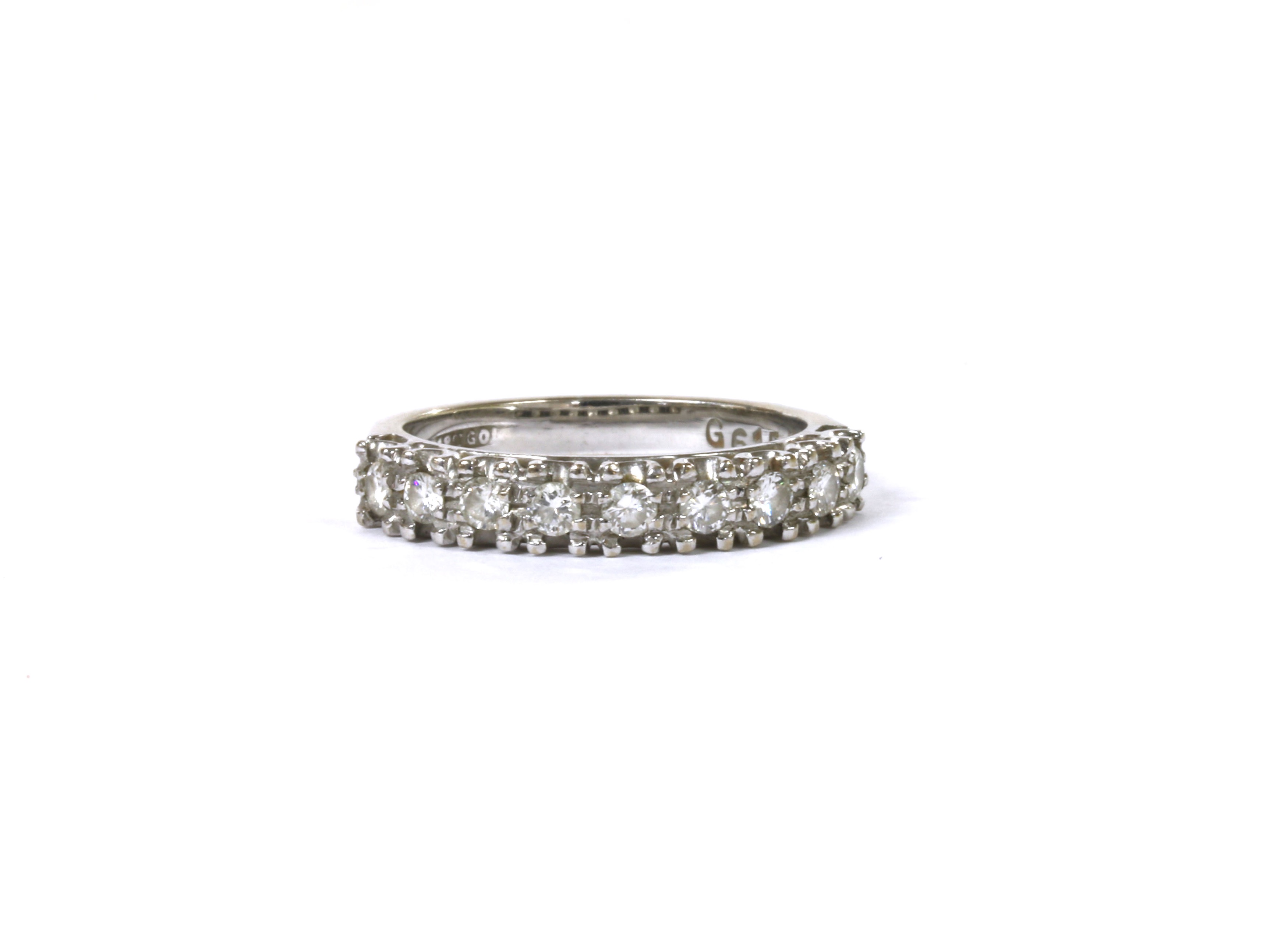 Lot 72 - A white gold nine stone diamond ring,