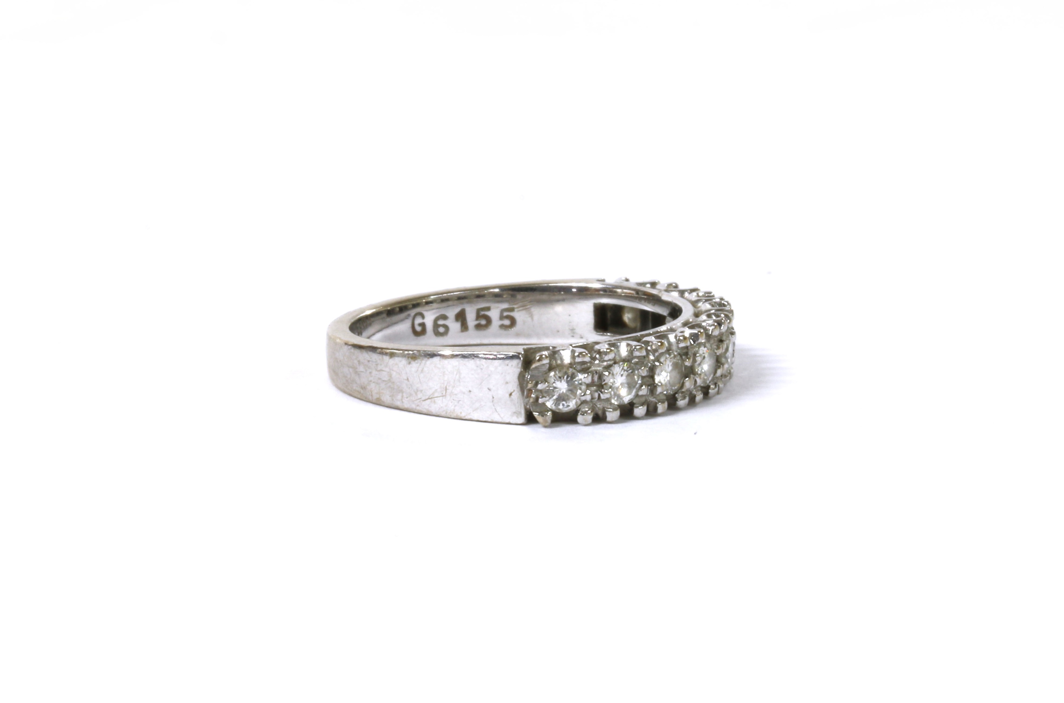 Lot 72 - A white gold nine stone diamond ring,