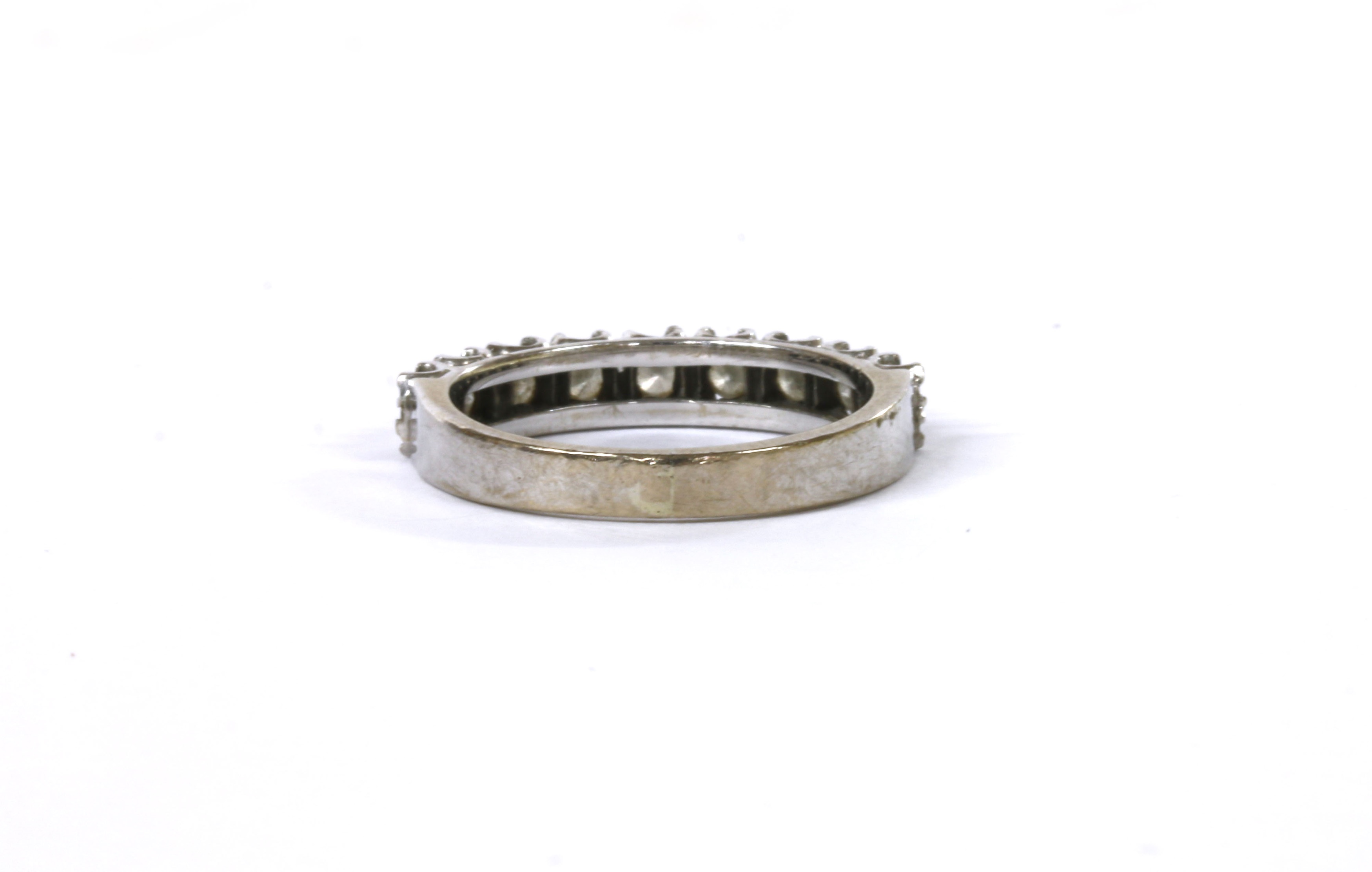 Lot 72 - A white gold nine stone diamond ring,