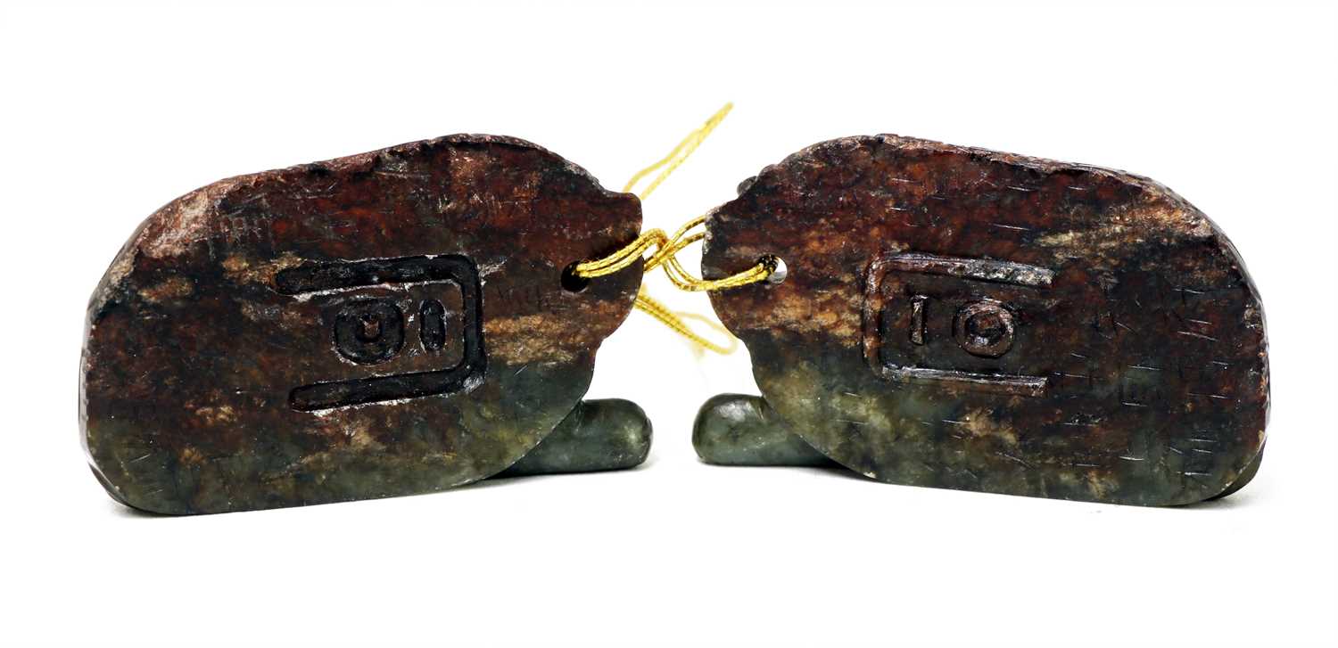 Lot 106 - A Chinese inscribed jade 'tiger' tally,