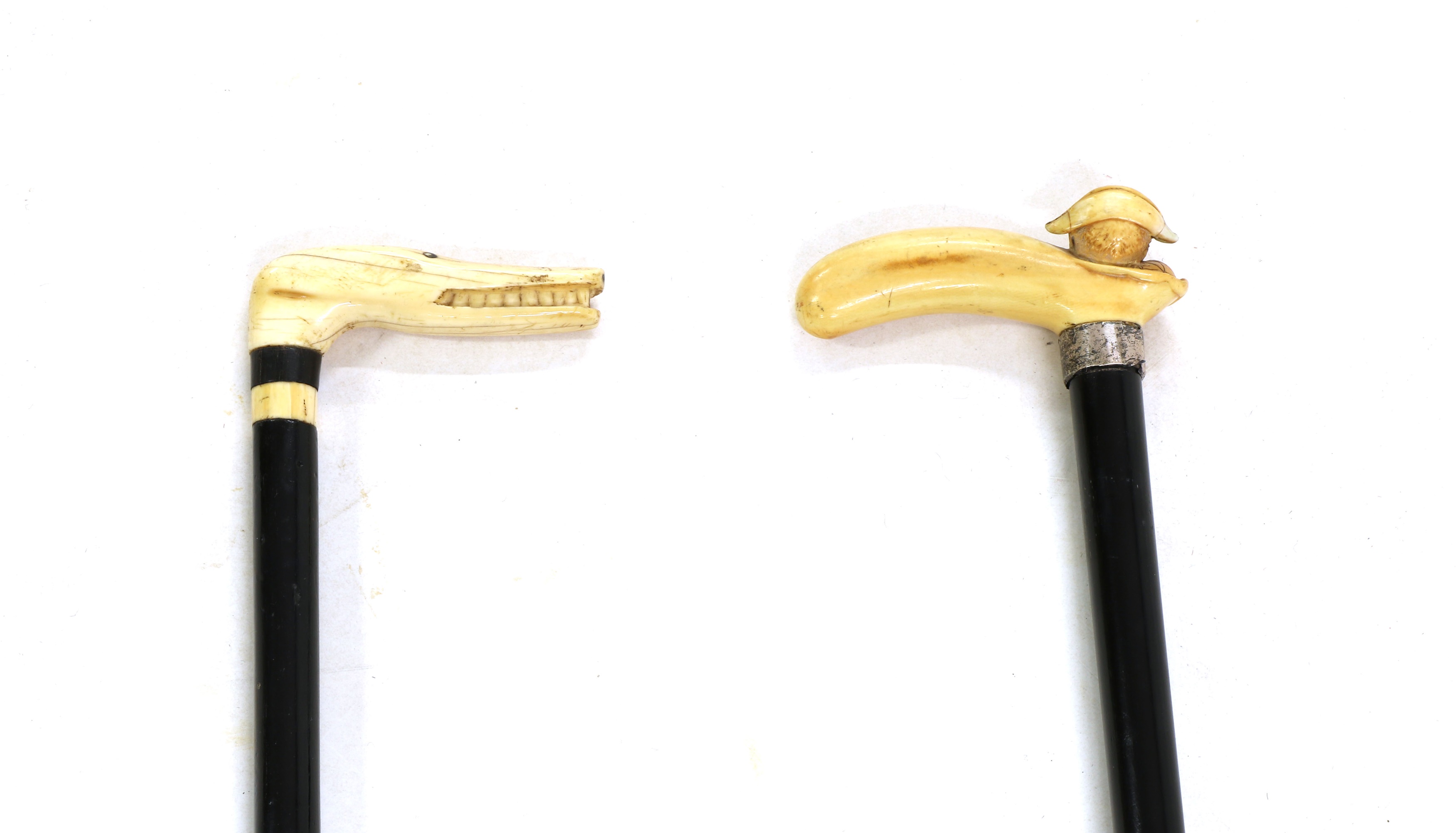 Lot 144 - A carved-ivory handled walking cane,