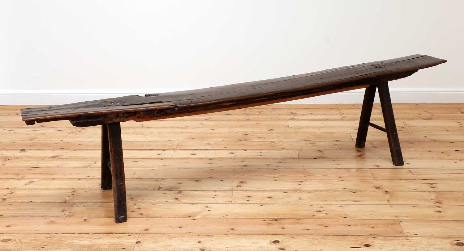 Lot 457 - A vernacular oak long bench,