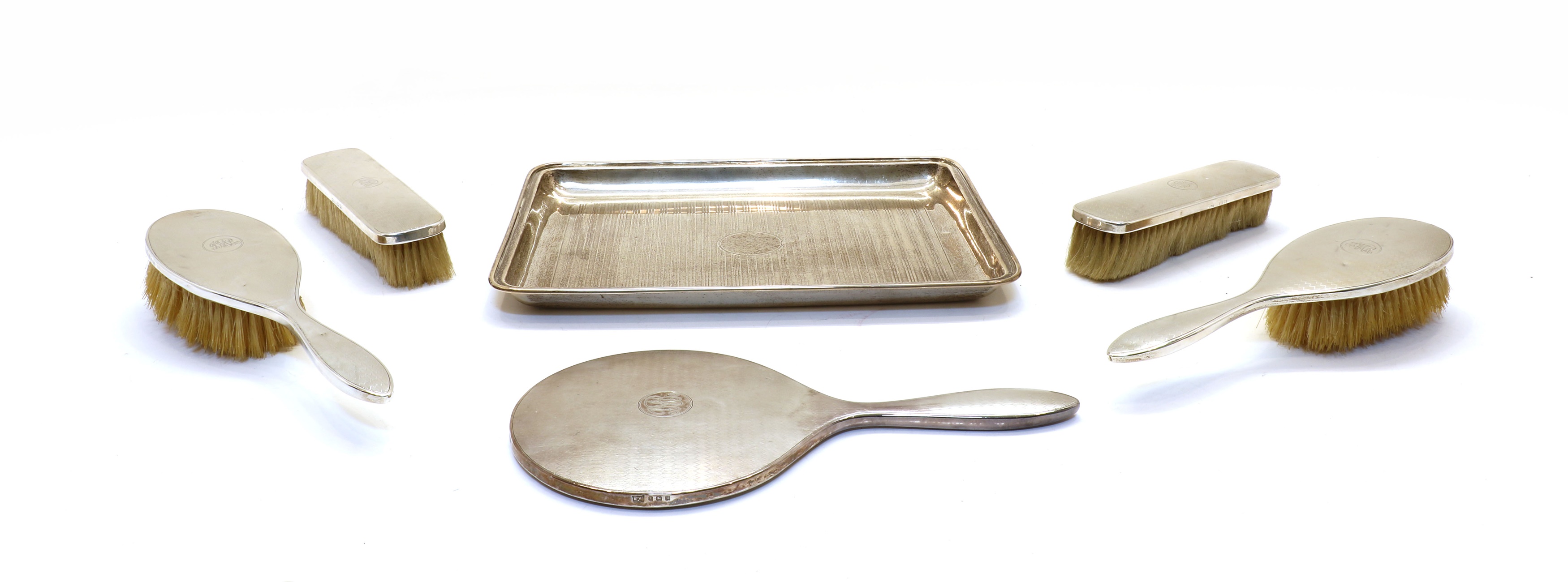 Lot 81 - A five piece silver backed dressing table set,