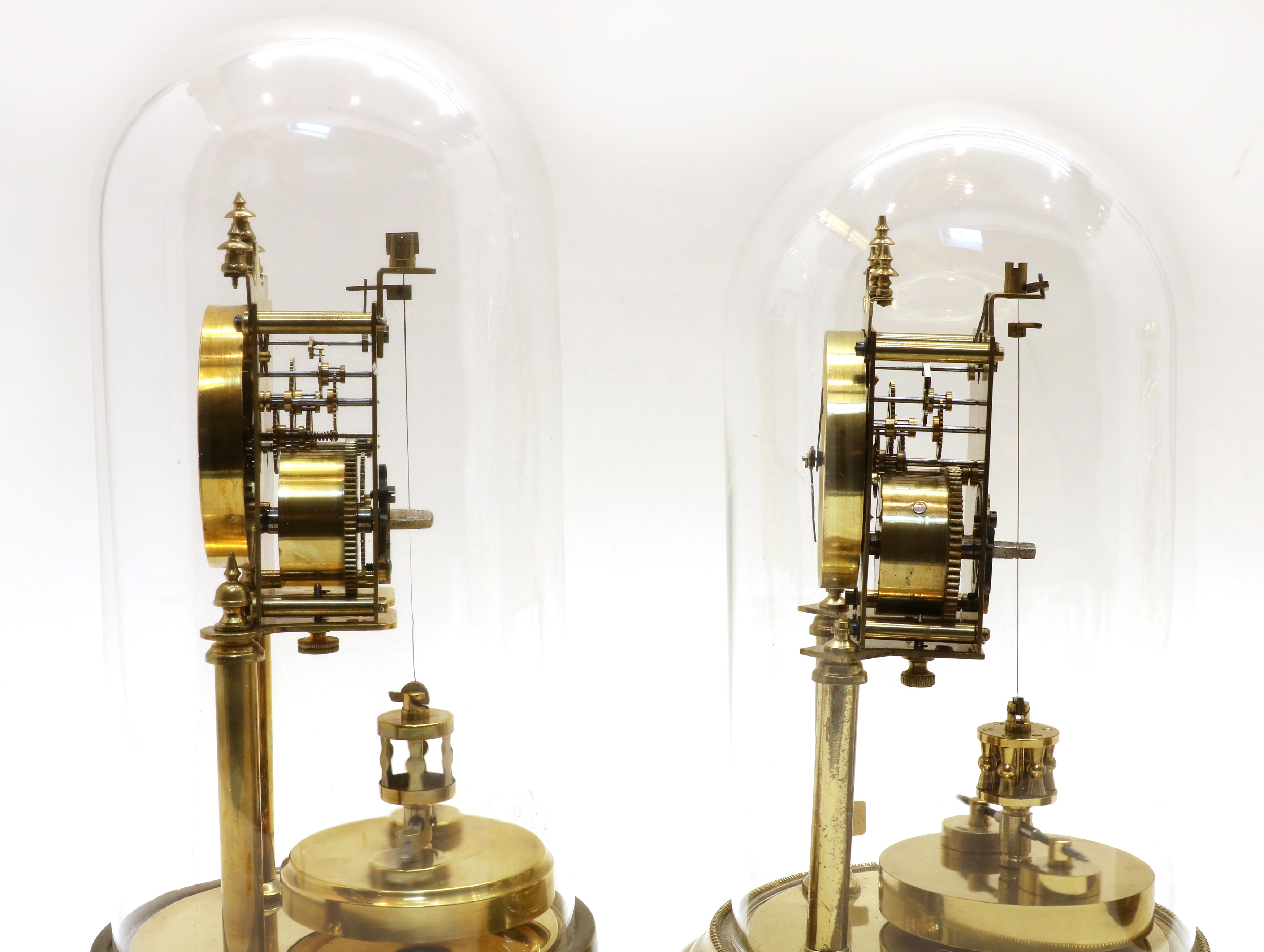 Lot 290 - Two brass torsion clocks