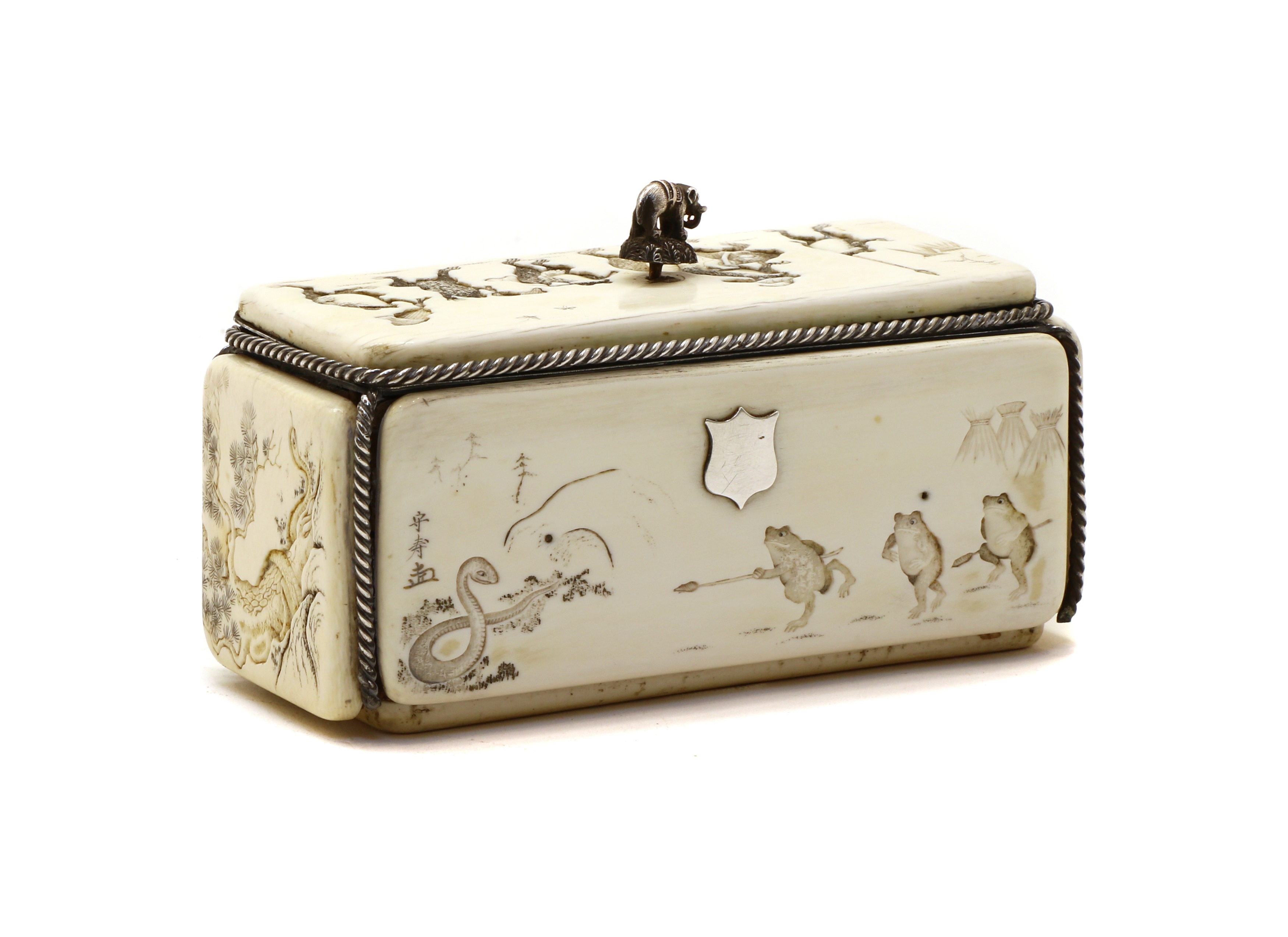 Lot 69 - A Japanese carved ivory and silver mounted