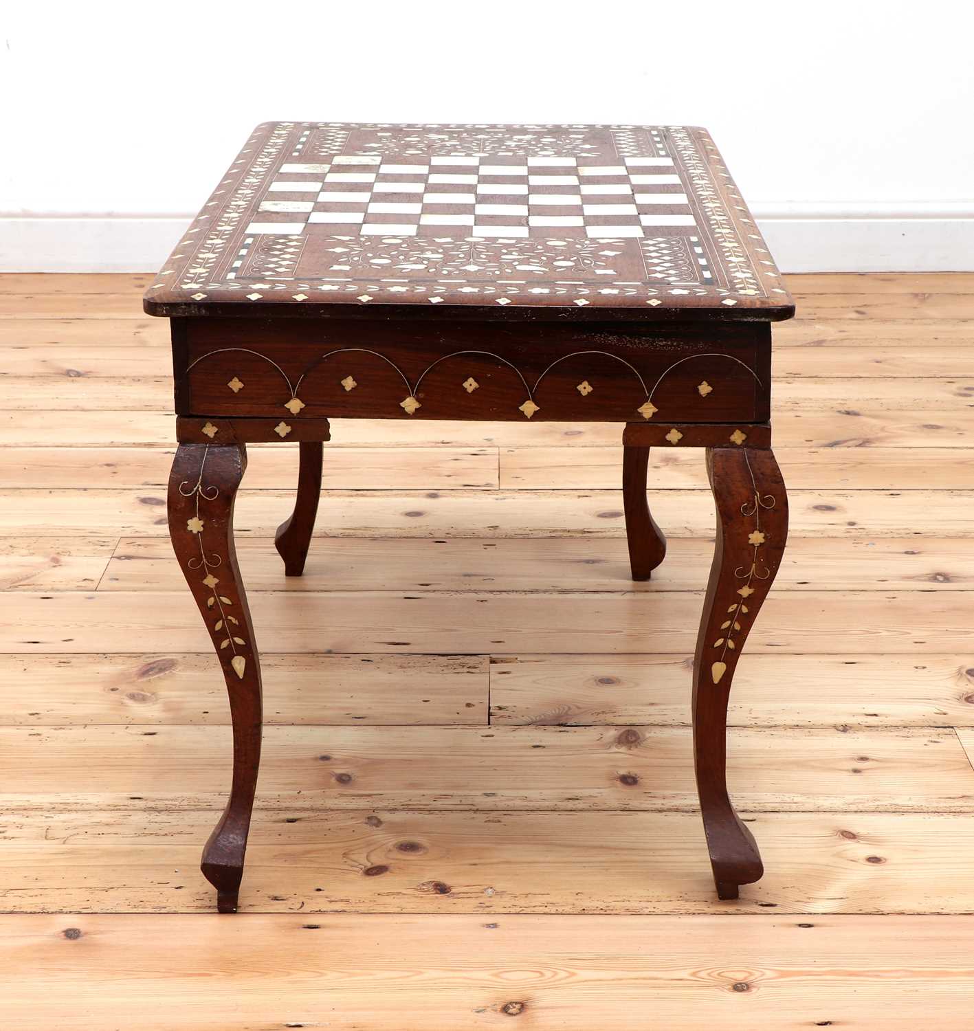 Lot 90 - An Indian low games table,