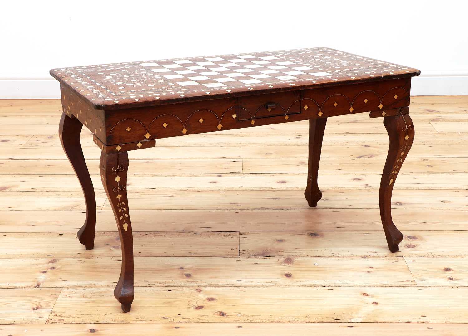 Lot 90 - An Indian low games table,