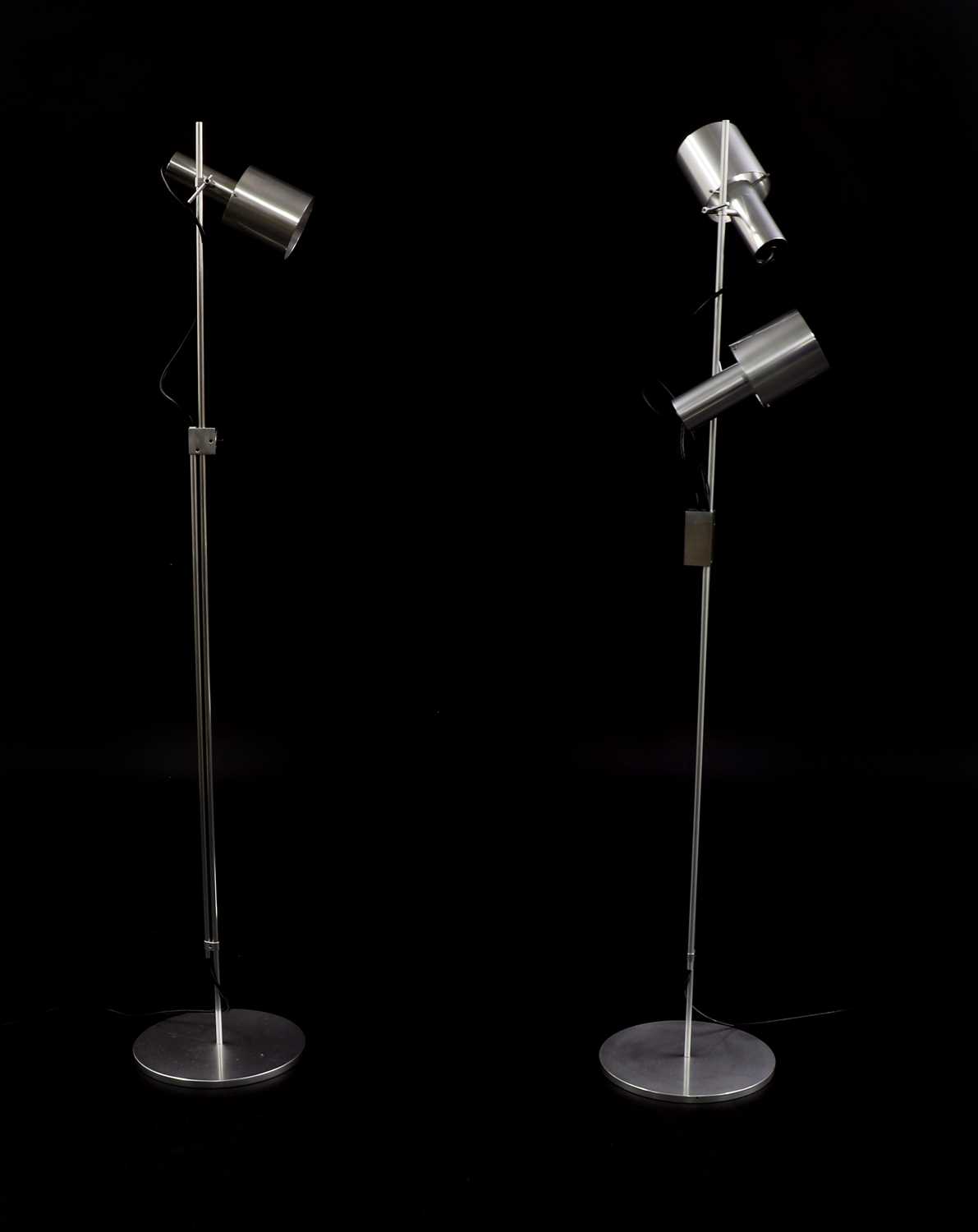 Lot 747 - Two brushed aluminium standard lamps,