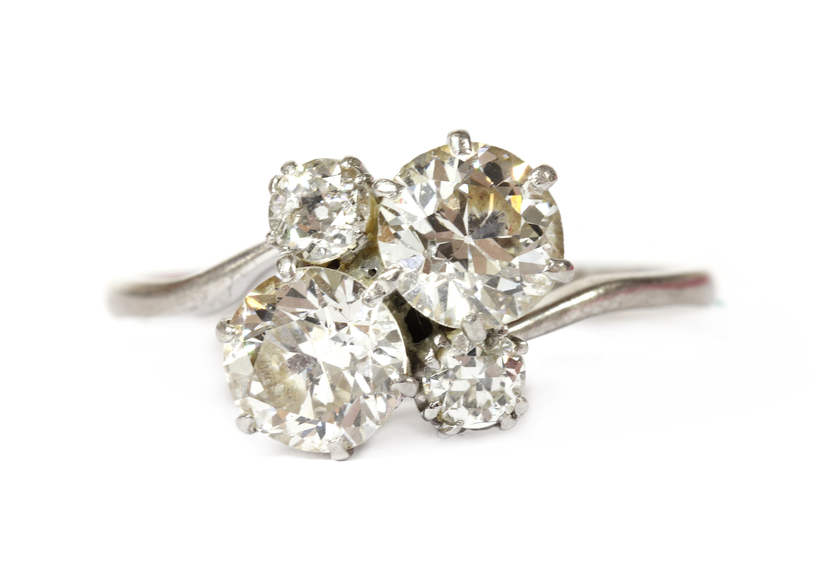Lot 1199 - A white gold four stone diamond cluster