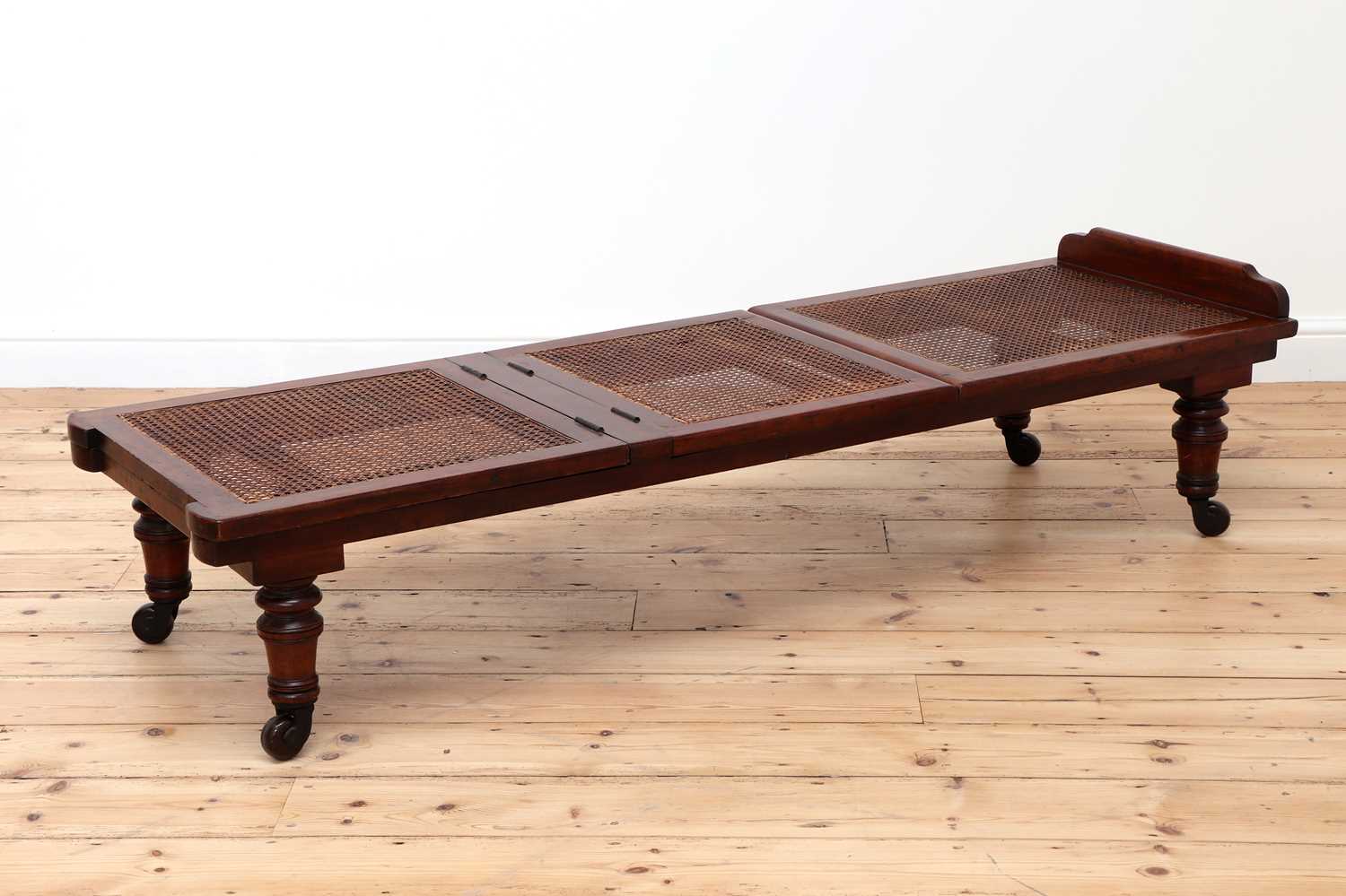 Lot 470 - A Victorian caned campaign daybed,