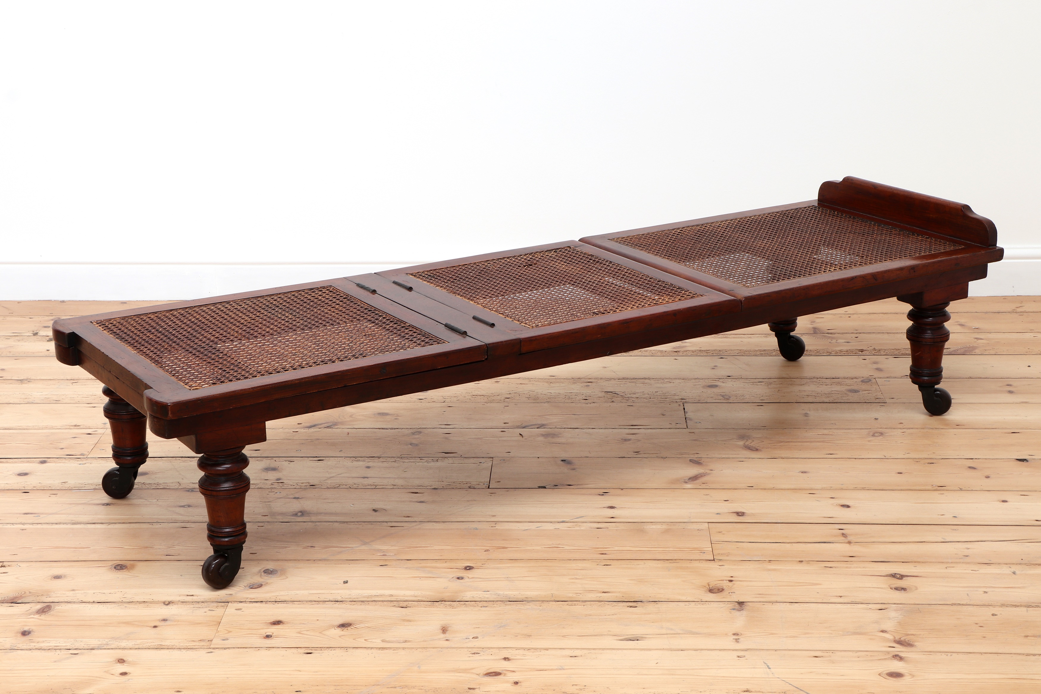 Lot 470 - A Victorian caned campaign daybed,