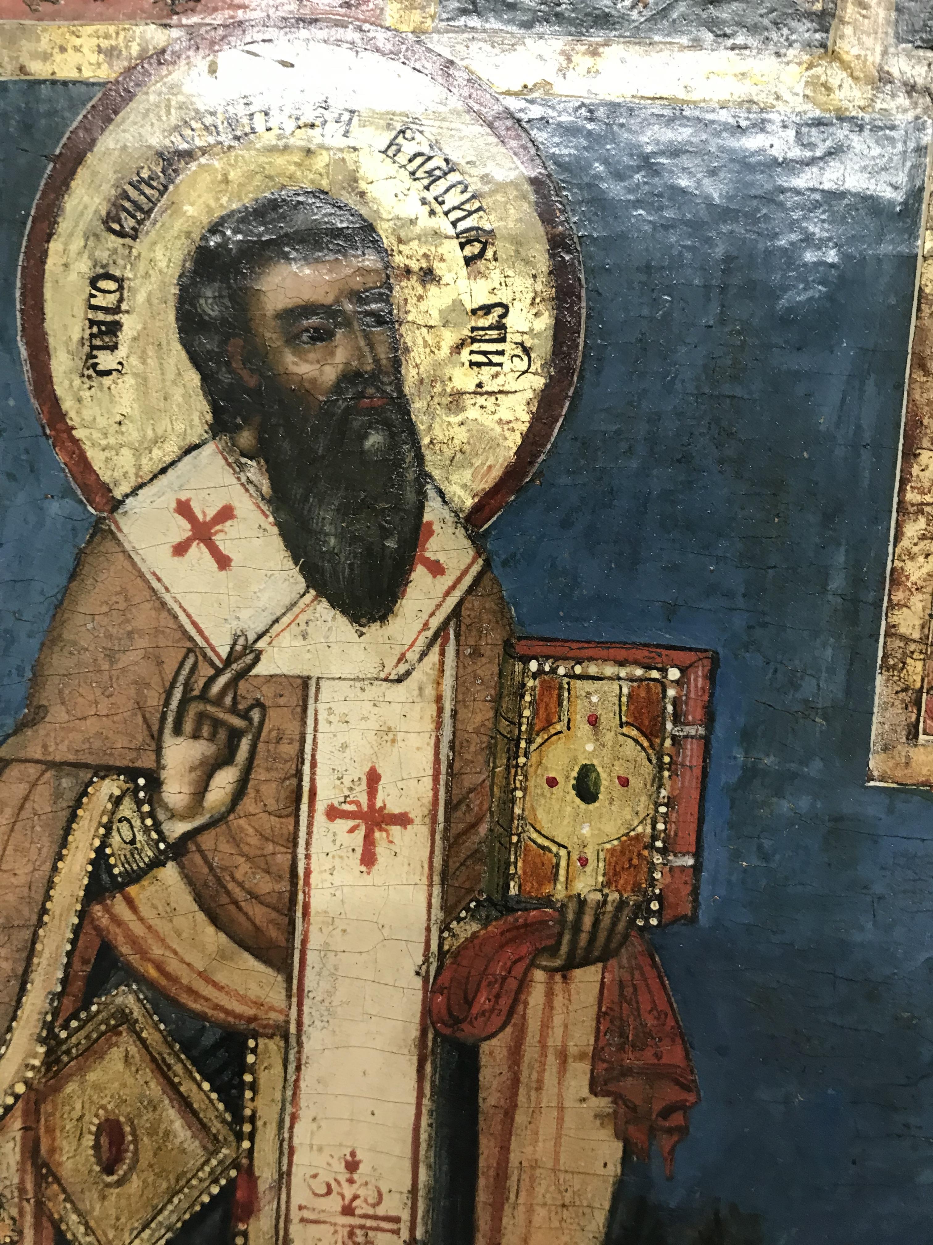 Lot 27 - A large icon of three saints venerating icons,