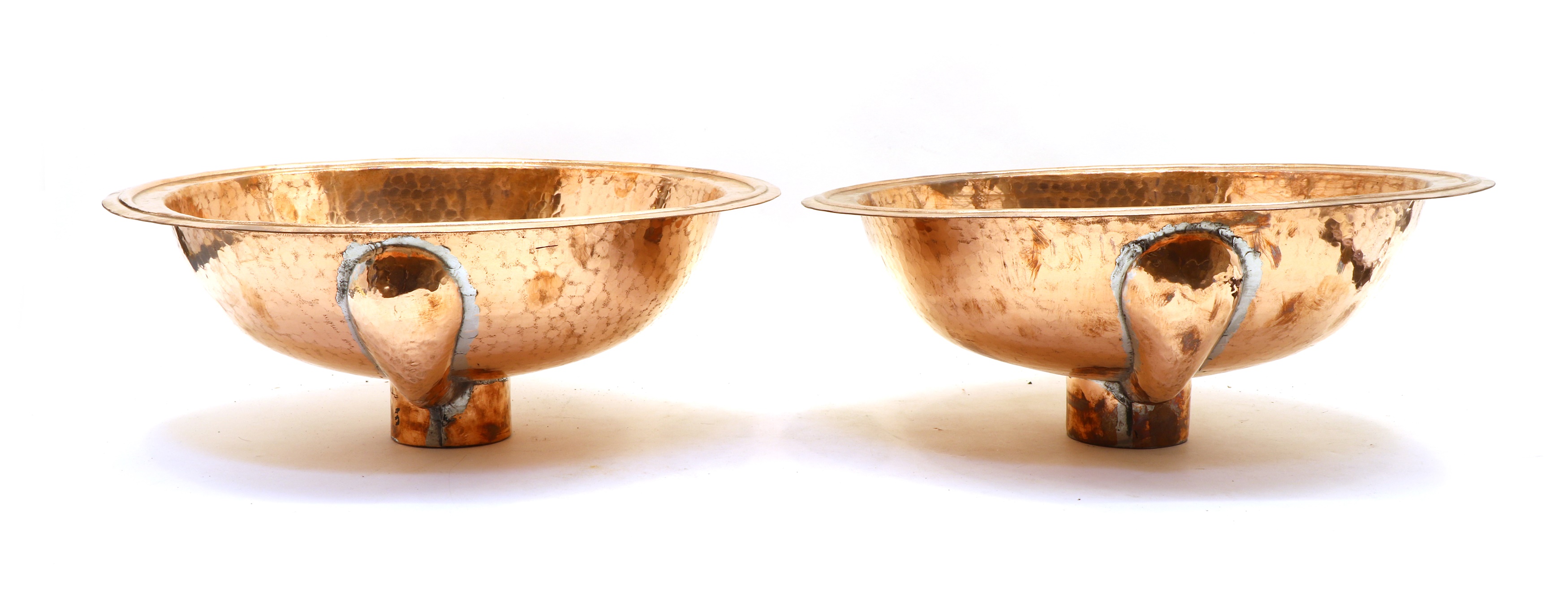 Lot 184 - A pair of hammered copper basins,