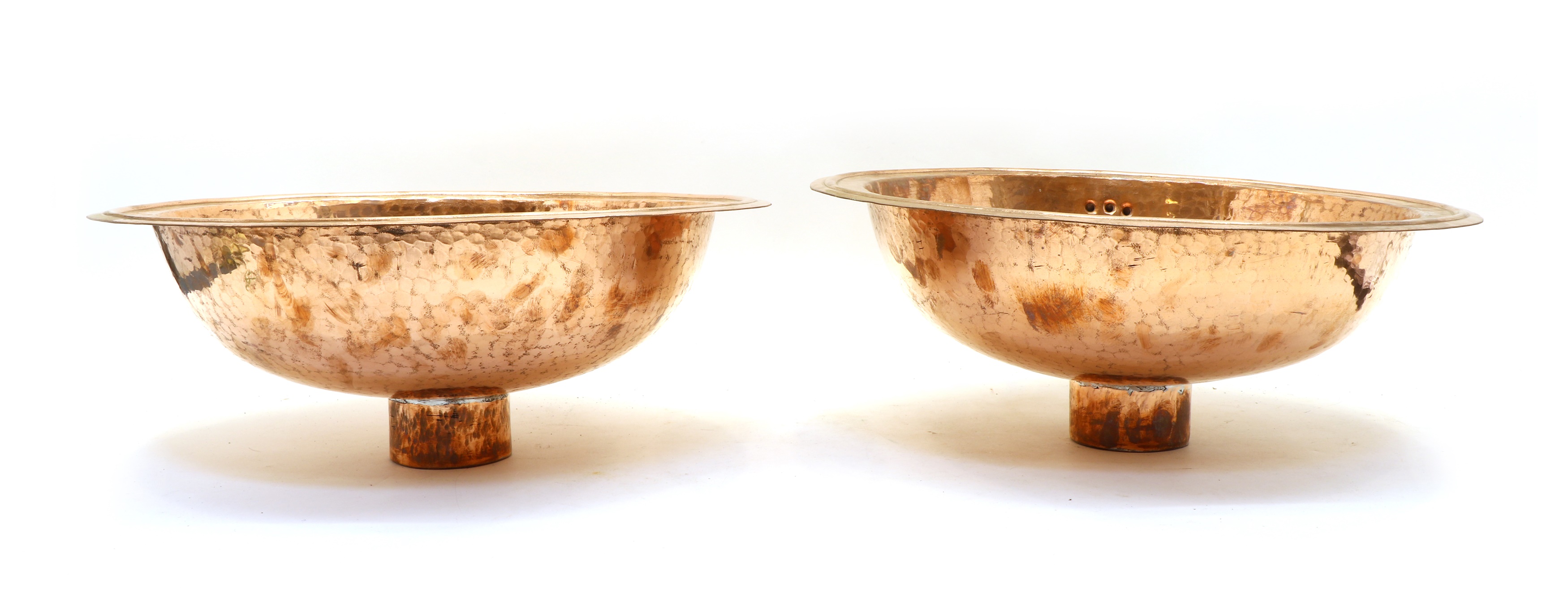 Lot 184 - A pair of hammered copper basins,
