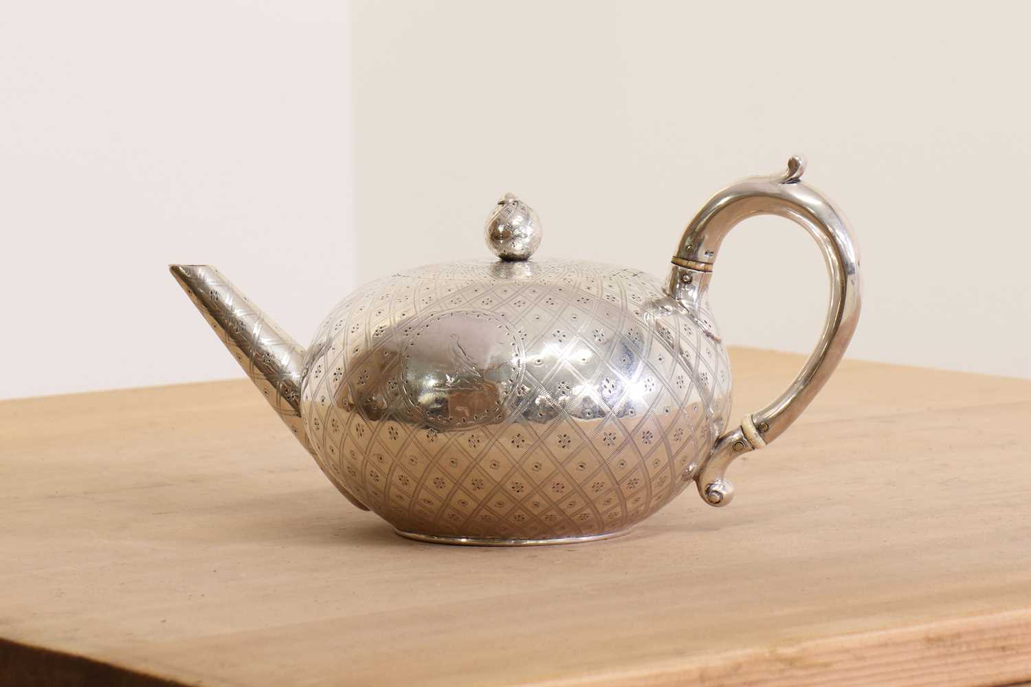 Lot 336 - A Victorian silver teapot with ivory