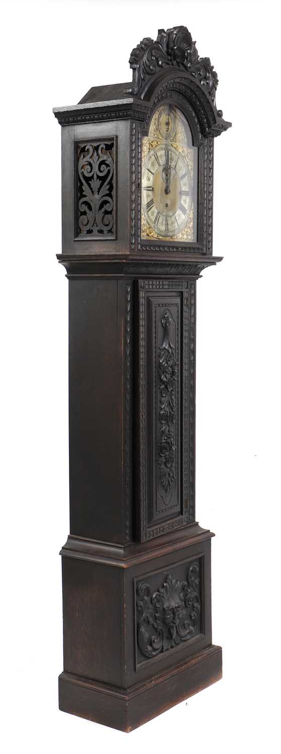 Lot 245 - A Finnigans oak longcase clock,
