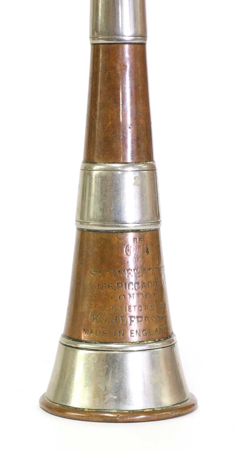 Lot 82 - A nickel-banded copper hunting horn,