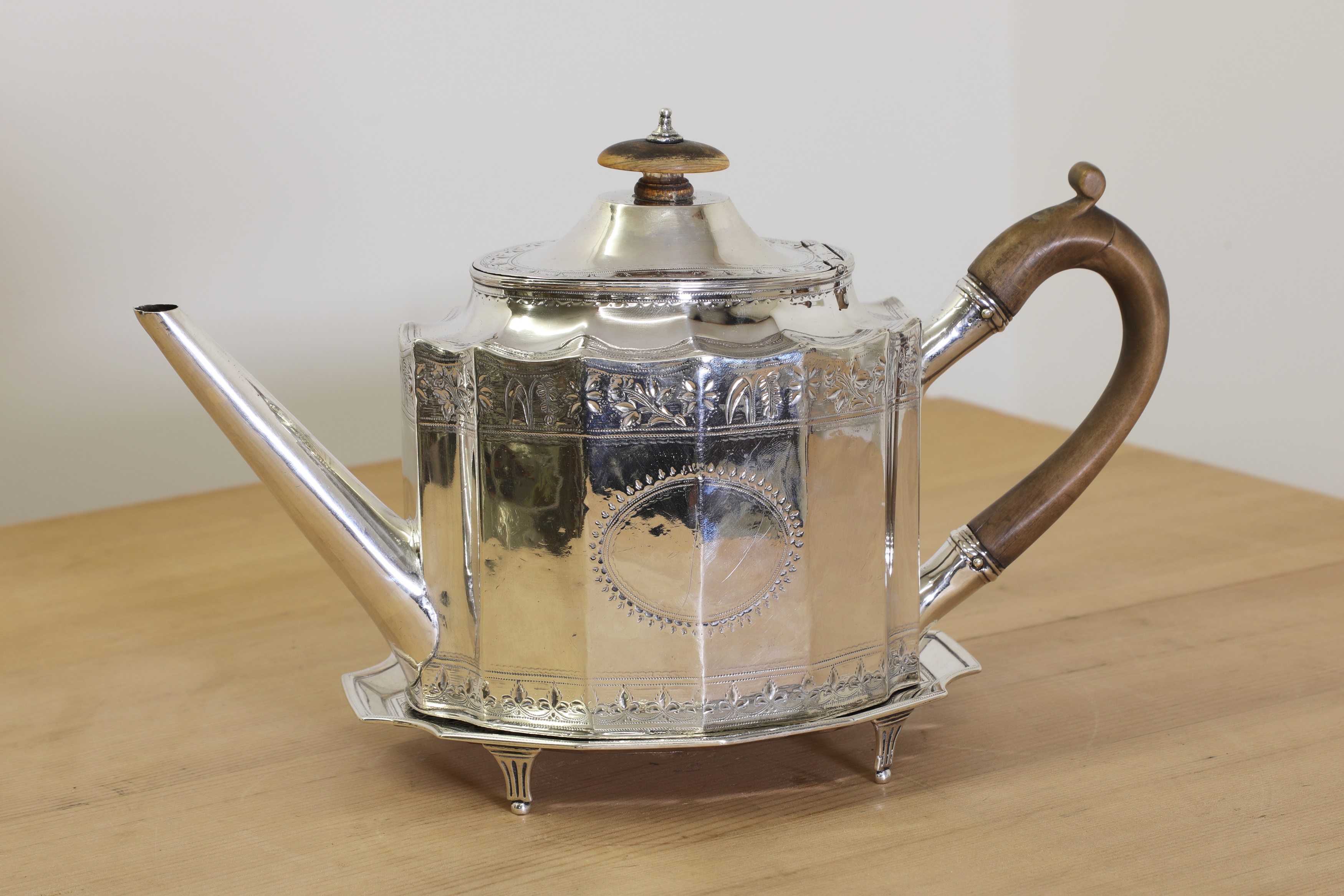 Lot 641 - A George III silver teapot and stand,