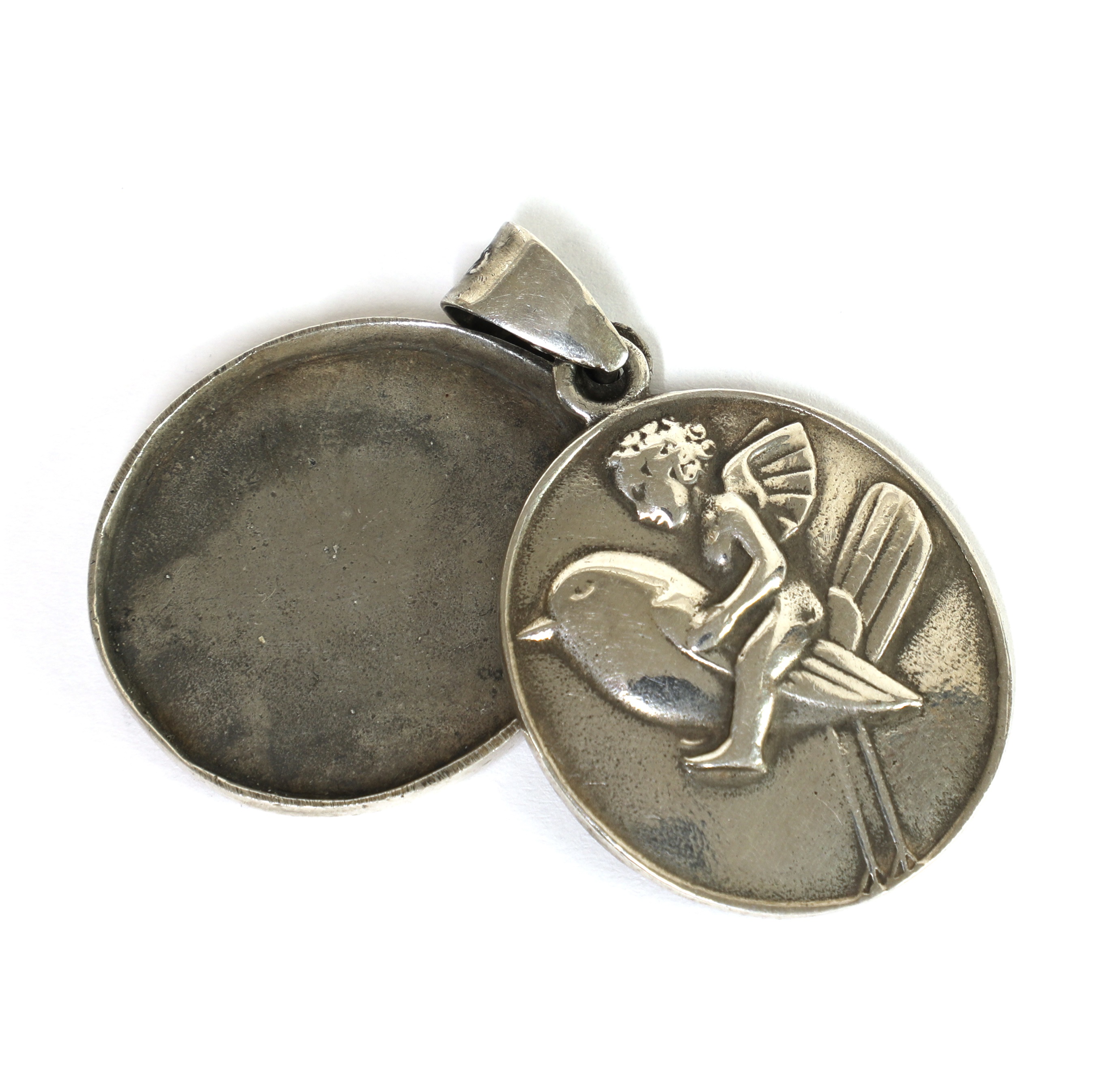 Lot 10 - A white metal locket,