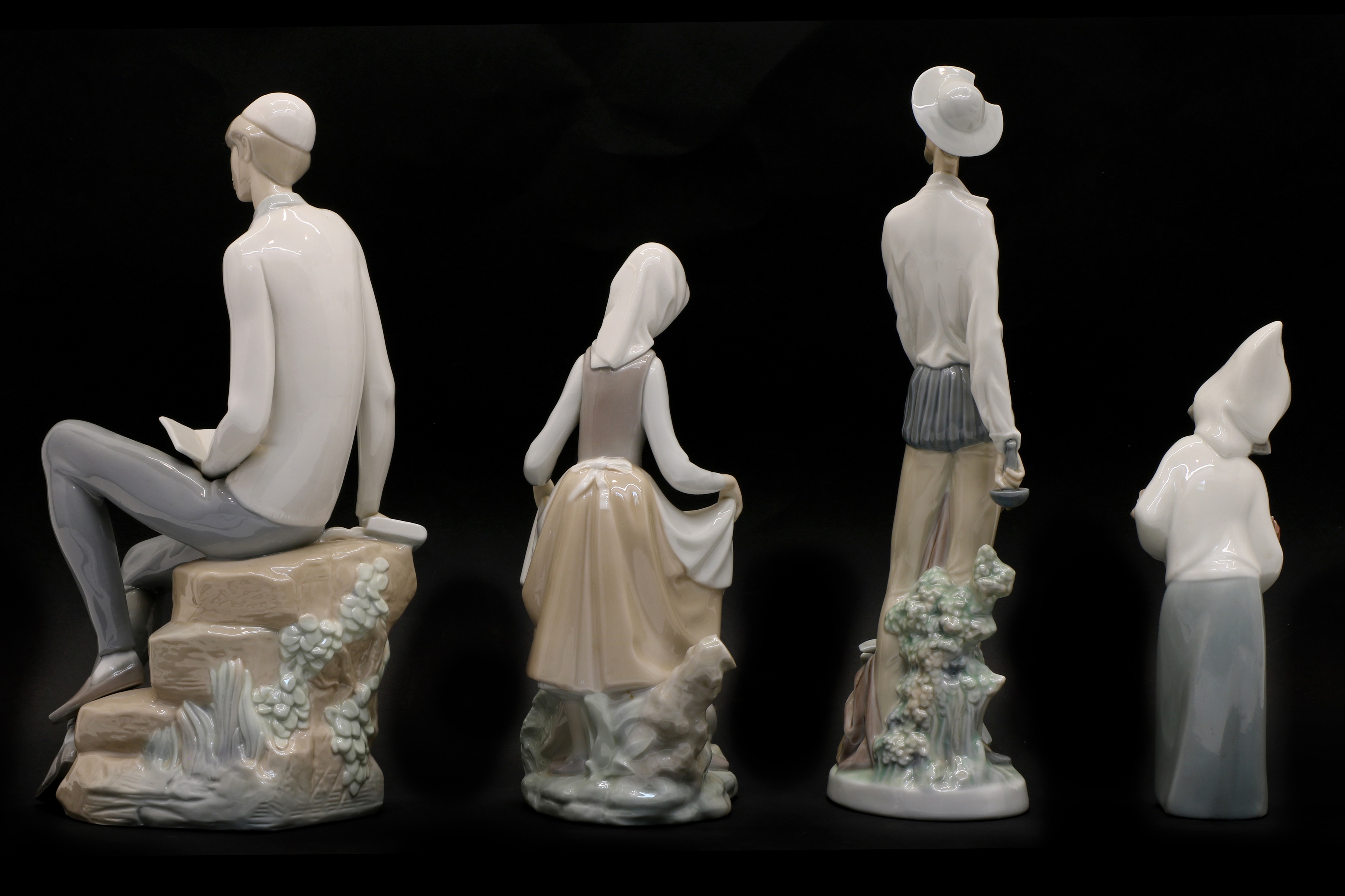 Lot 215 - A group of four Lladro figures,