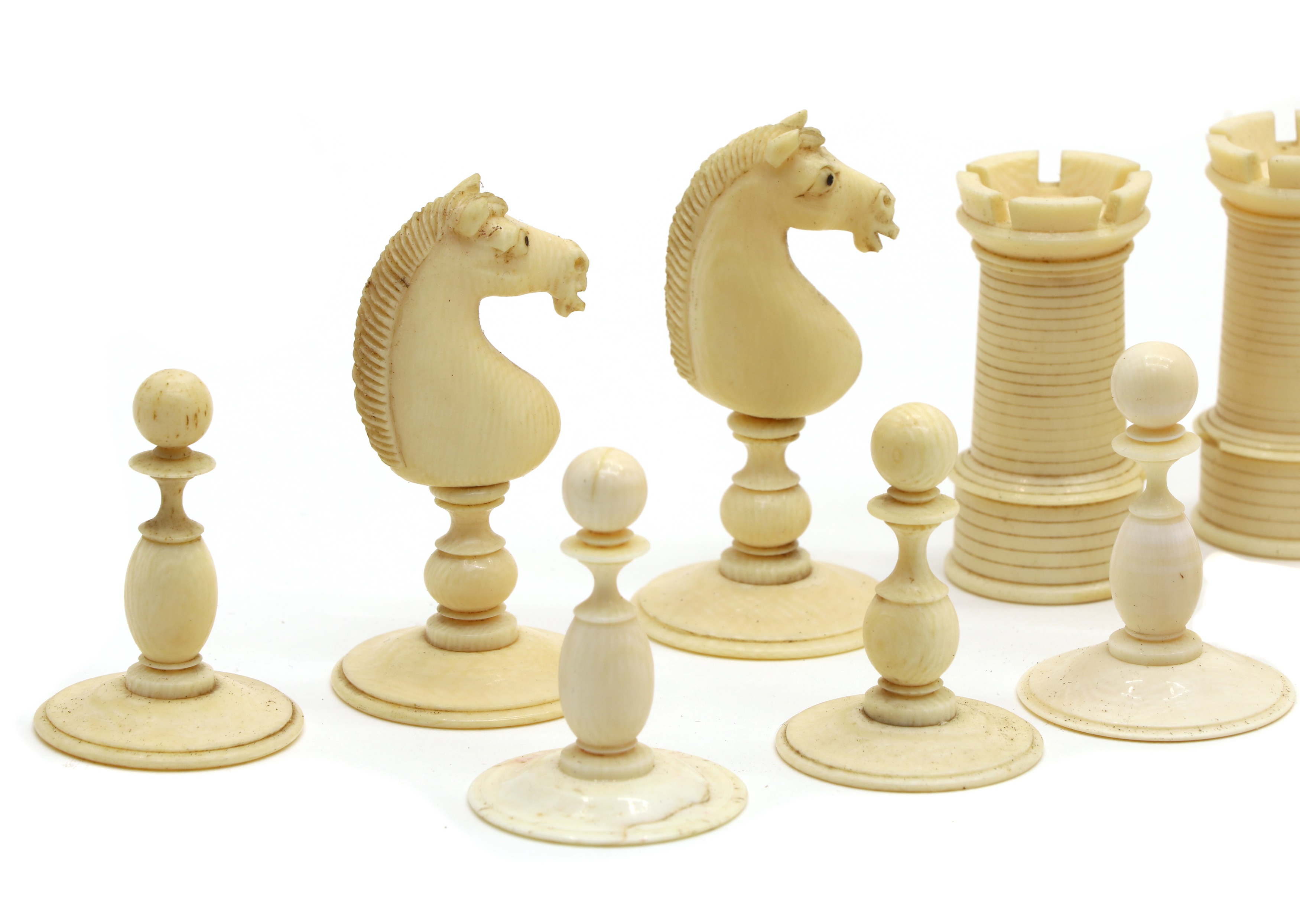Lot 63 - A plain and stained ivory chess set,
