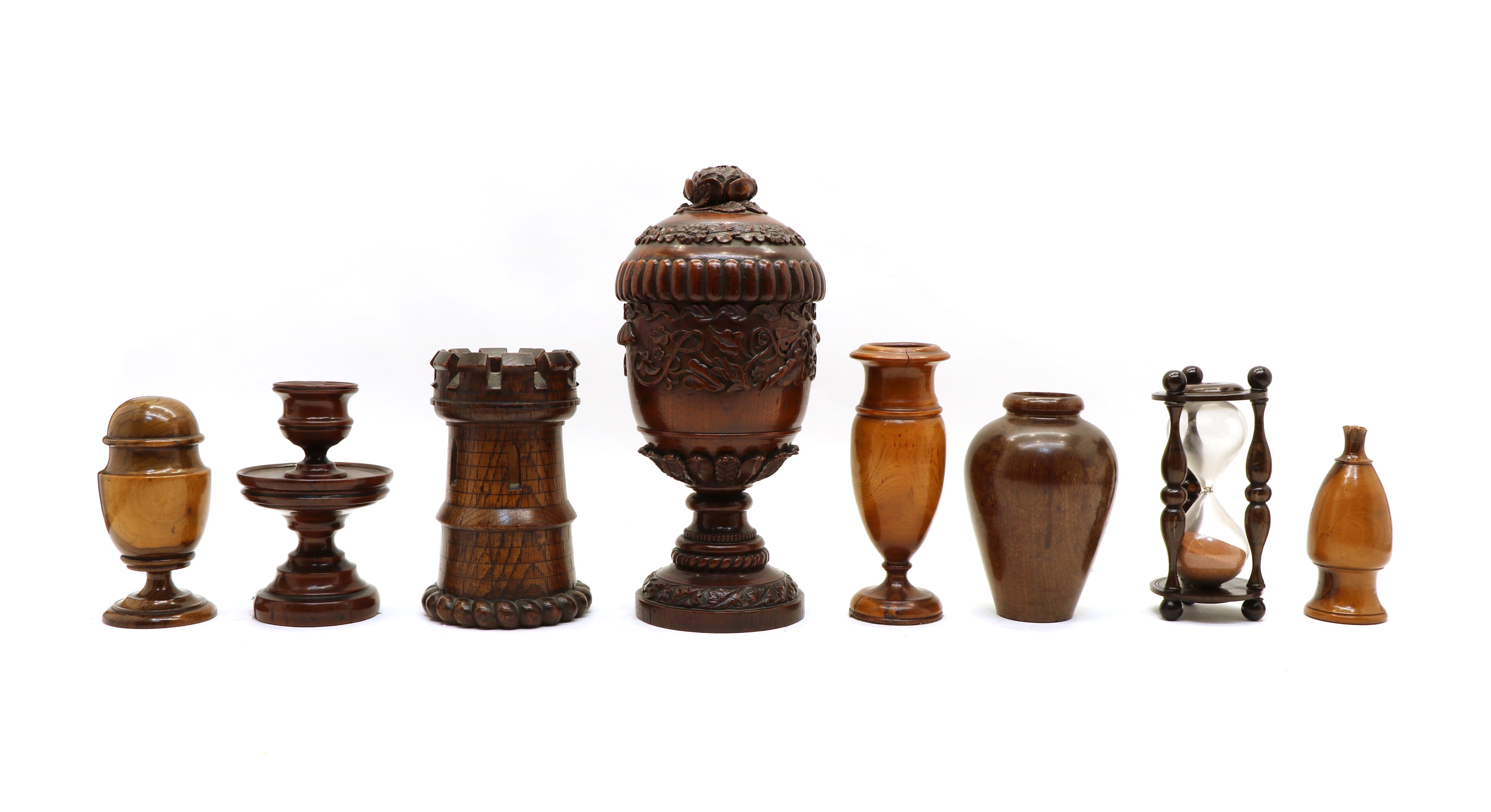 Lot 184 - A carved oak cup and cover,