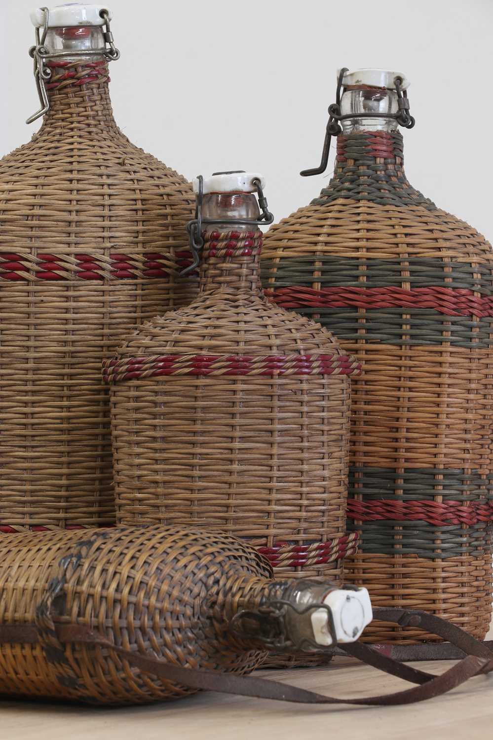 Lot 72 - A group of four wicker-clad bottles,