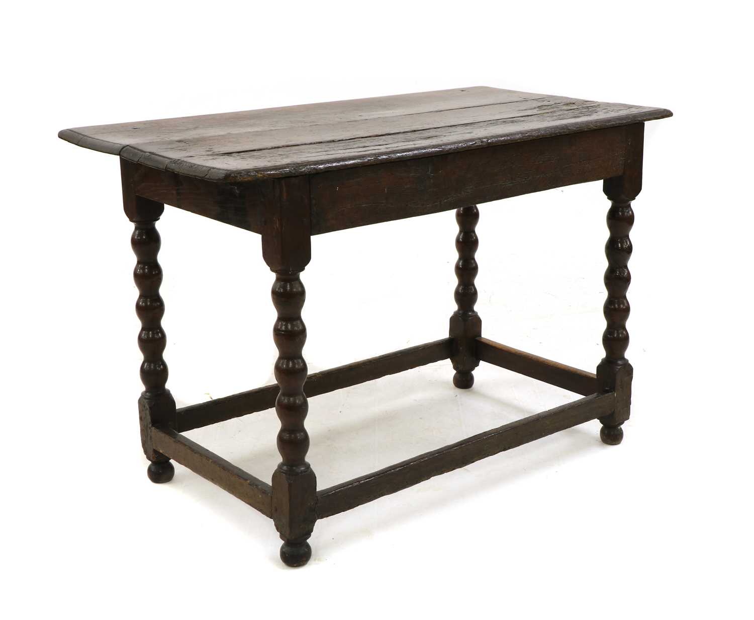 Lot 335 - A 17th century oak side table,