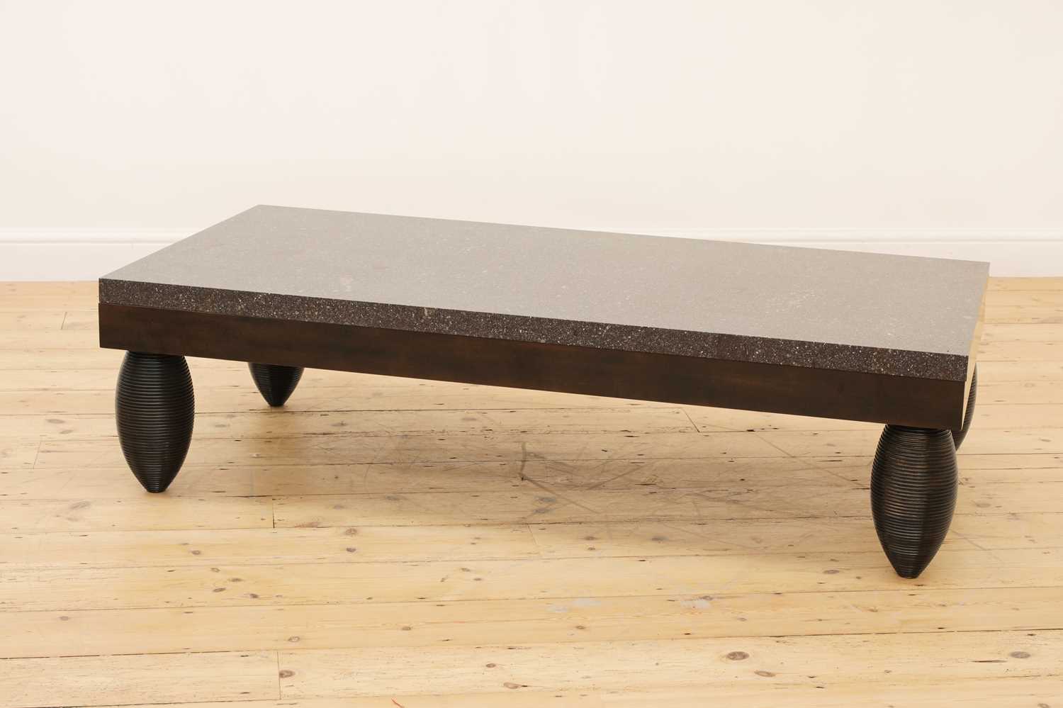 Lot 256 - A porphyry-topped rectangular low table,