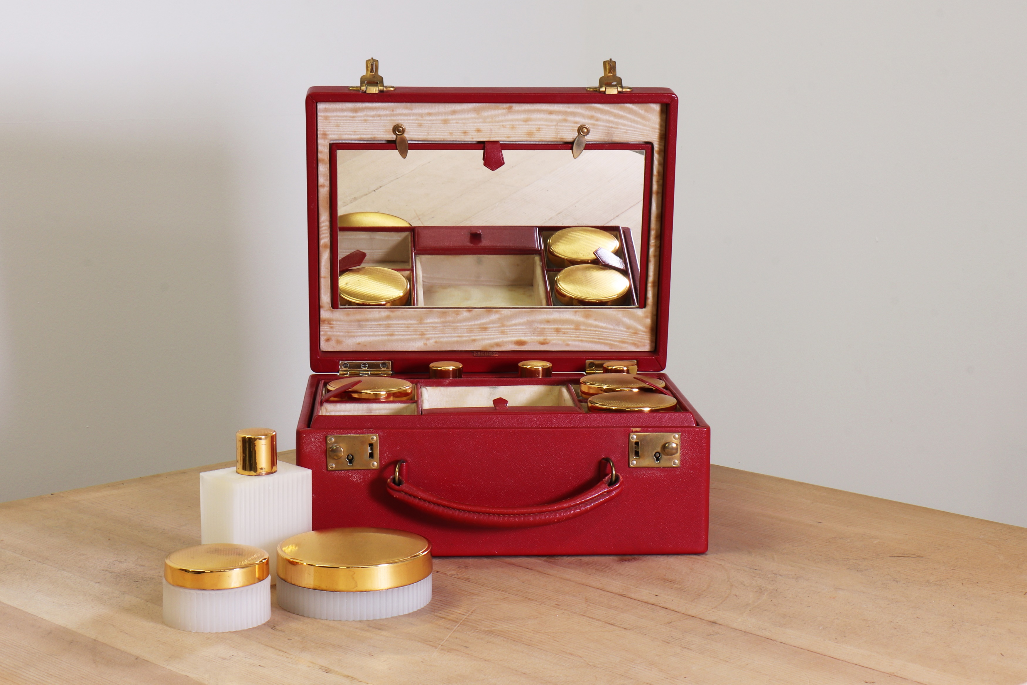 Lot 38 - A red leather vanity case by Asprey London,