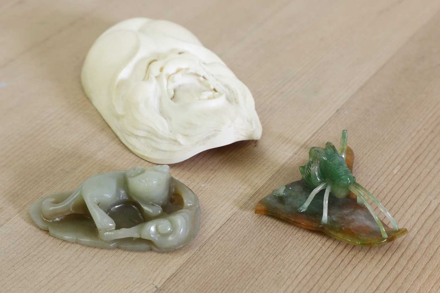 Lot 165 - A Japanese carved ivory mask,