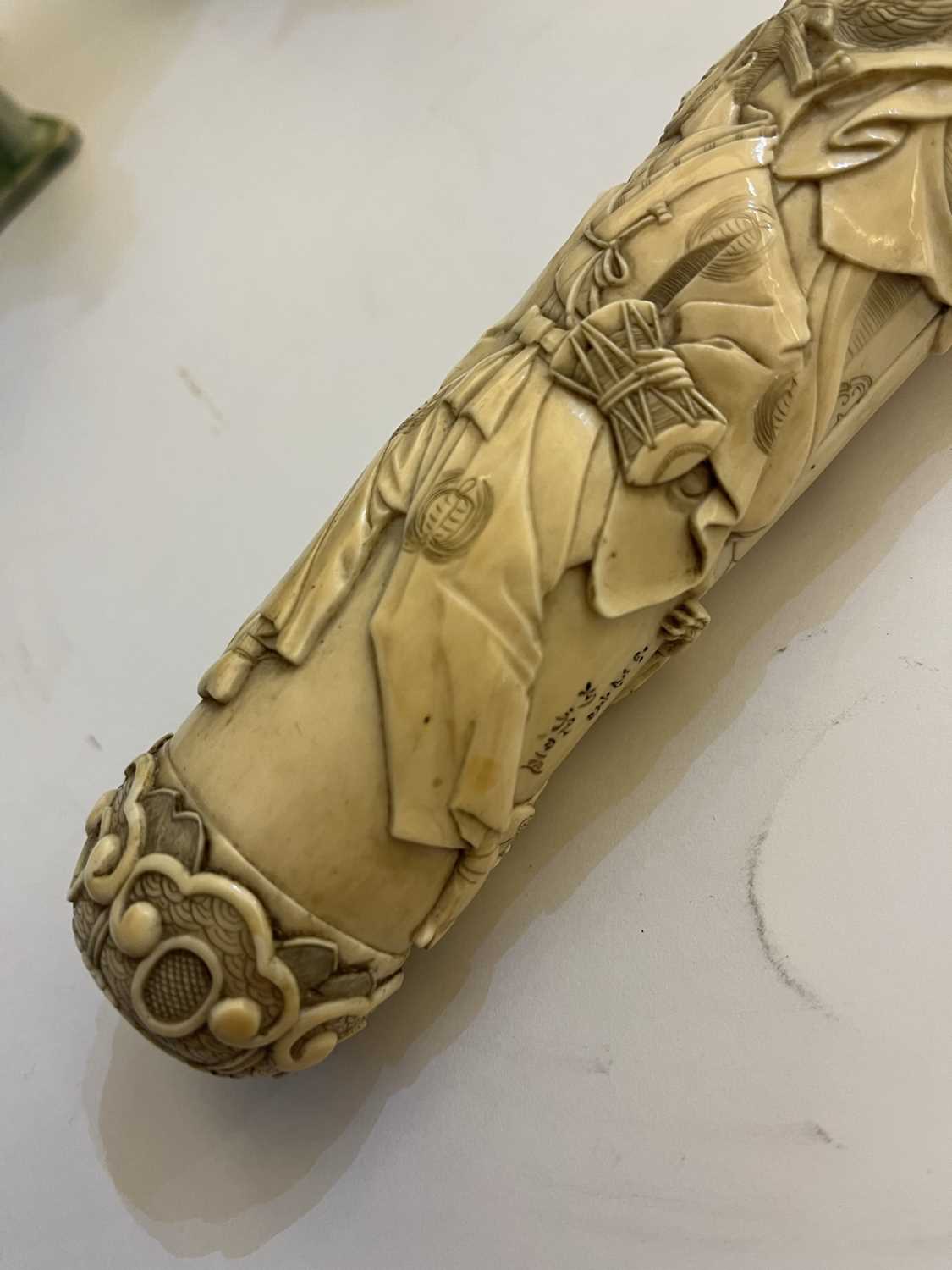 Lot 181 - A Japanese carved ivory short sword,