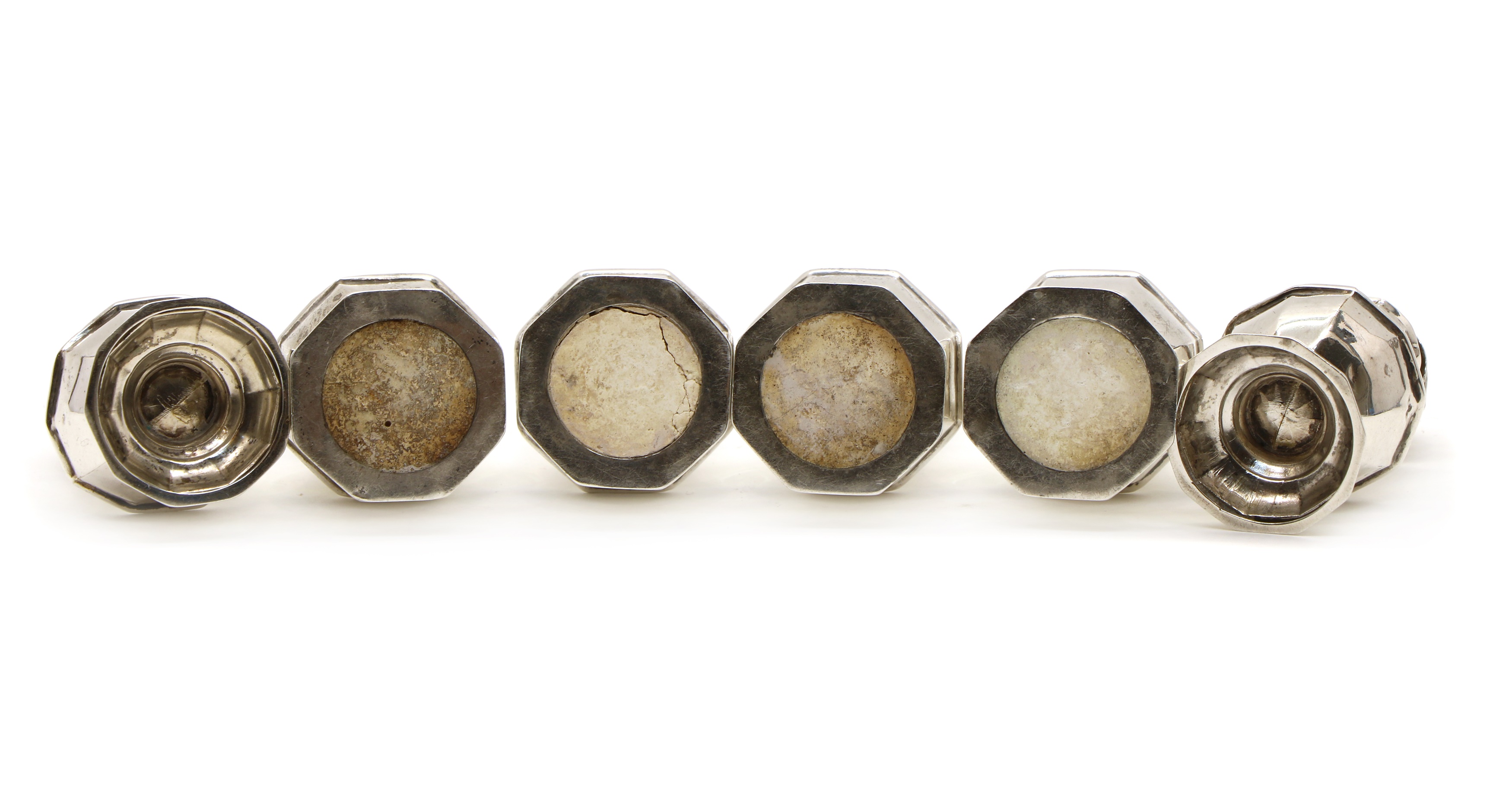 Lot 21 - A set of four silver pepperettes,